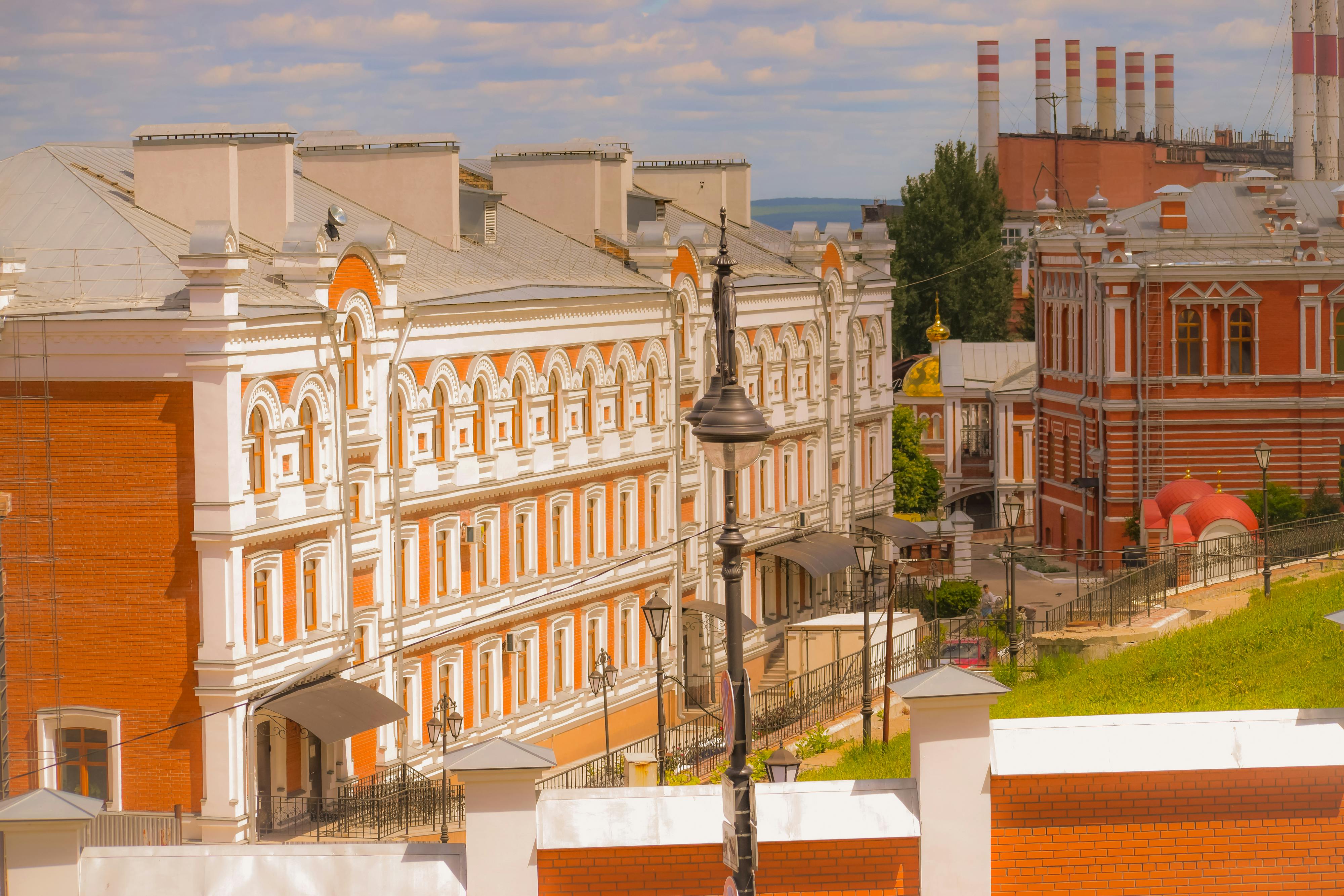 Woman in Purple Spaghetti Strap Top and Ripped Denim Jeans Leaning on a ...