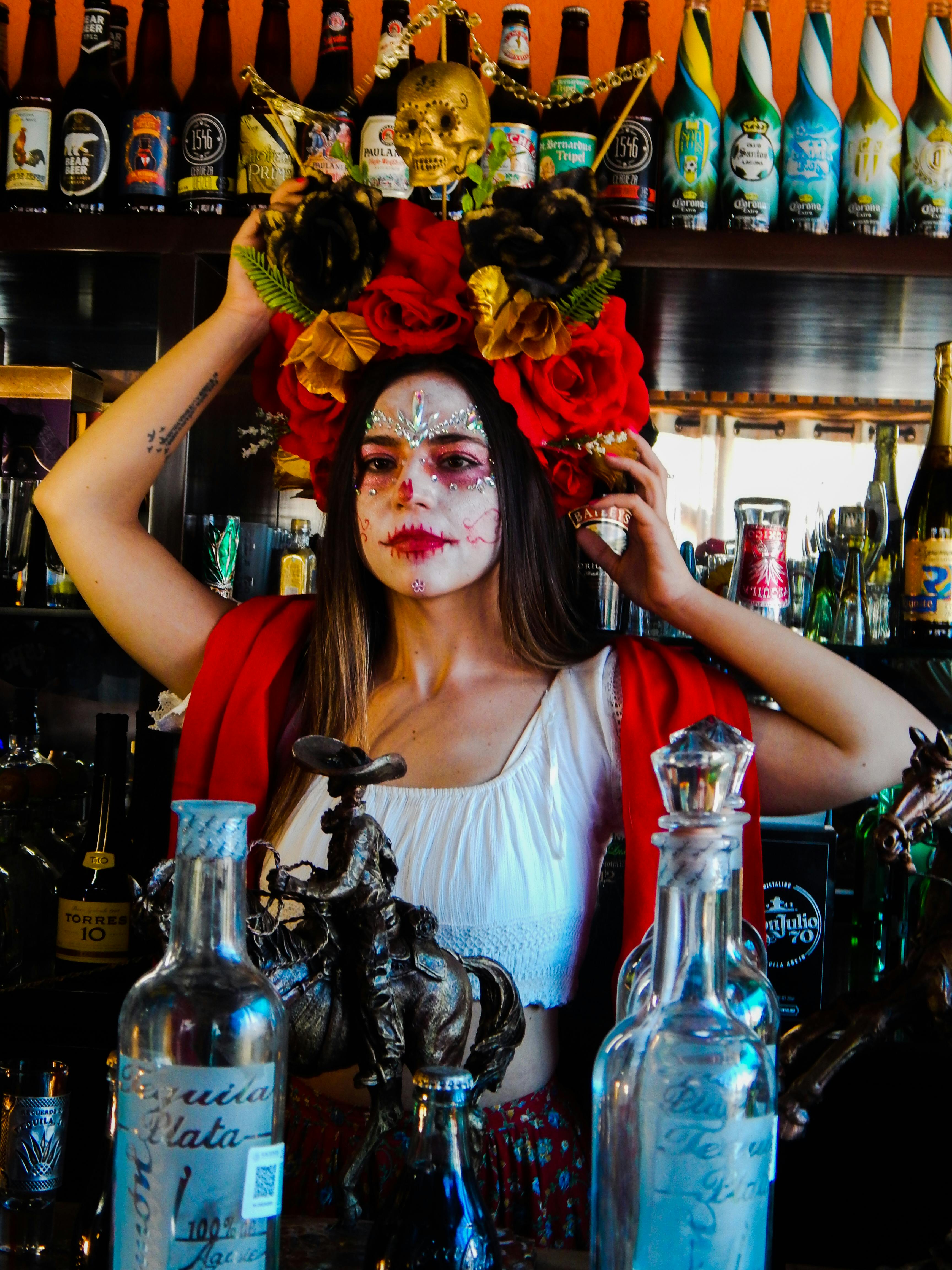 Woman Dressed as Catrina in Bar · Free Stock Photo