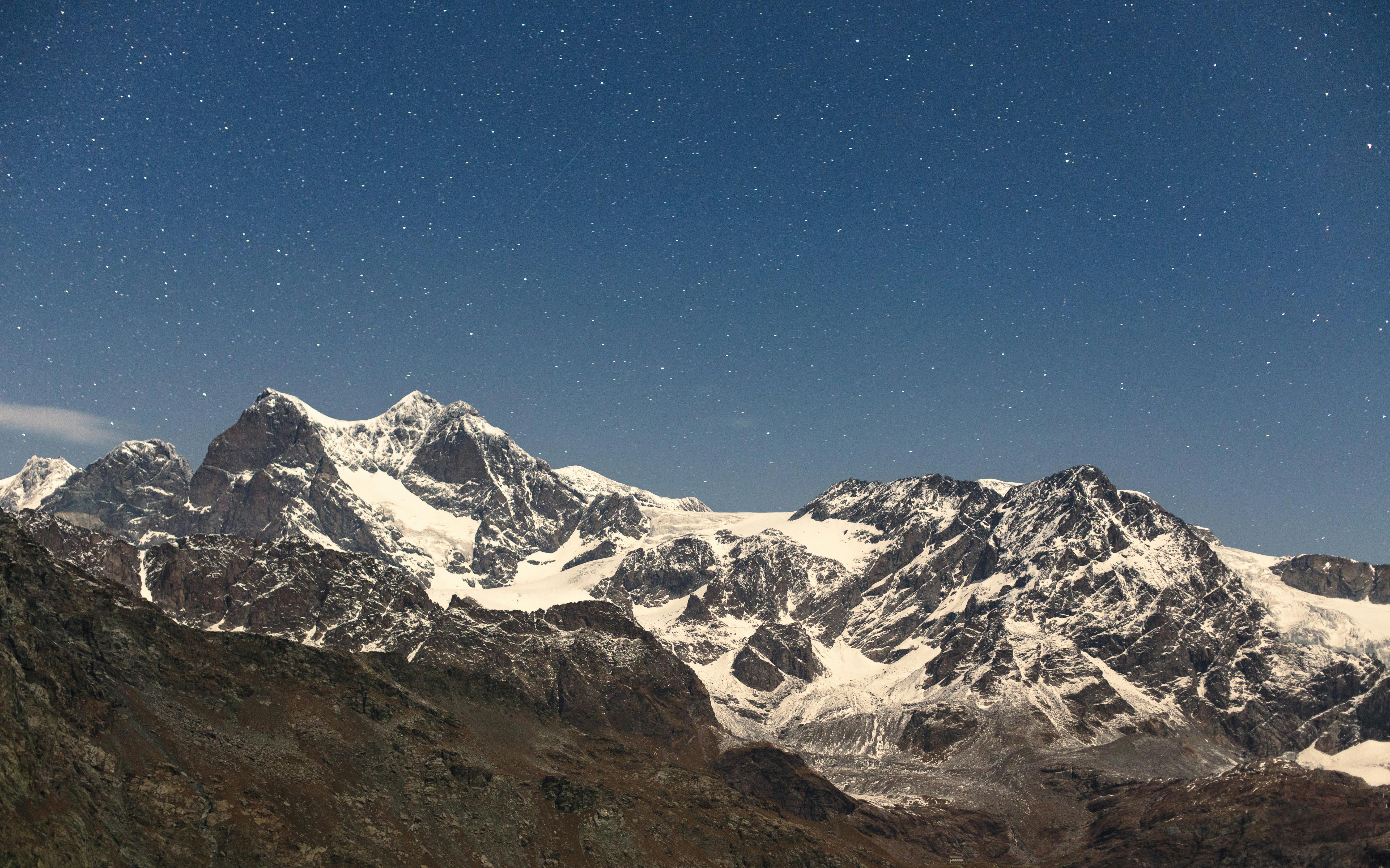 Snow Capped Mountains Under the Starry Blue Sky · Free Stock Photo