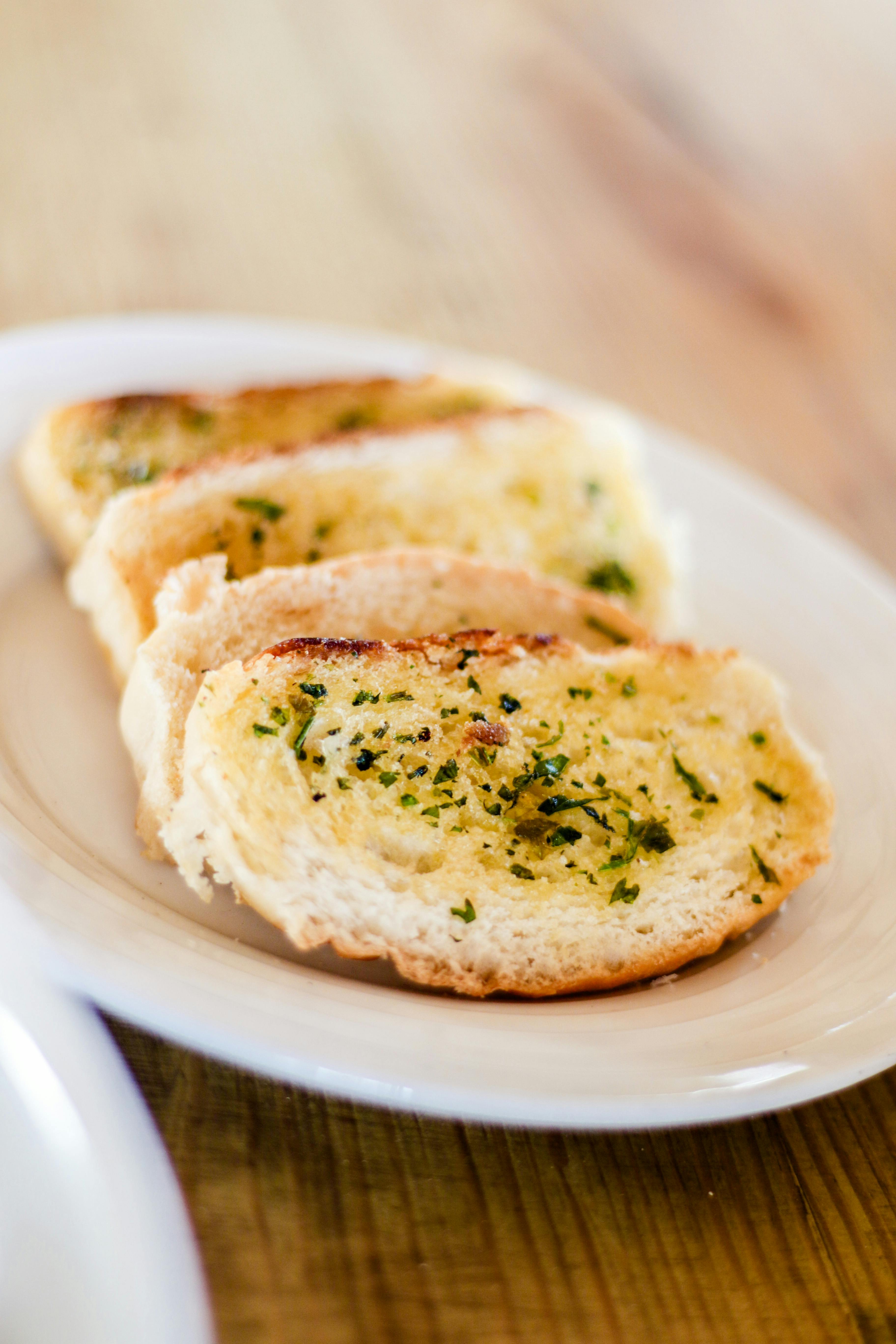 A Plate of Slices of Garlic Bread · Free Stock Photo