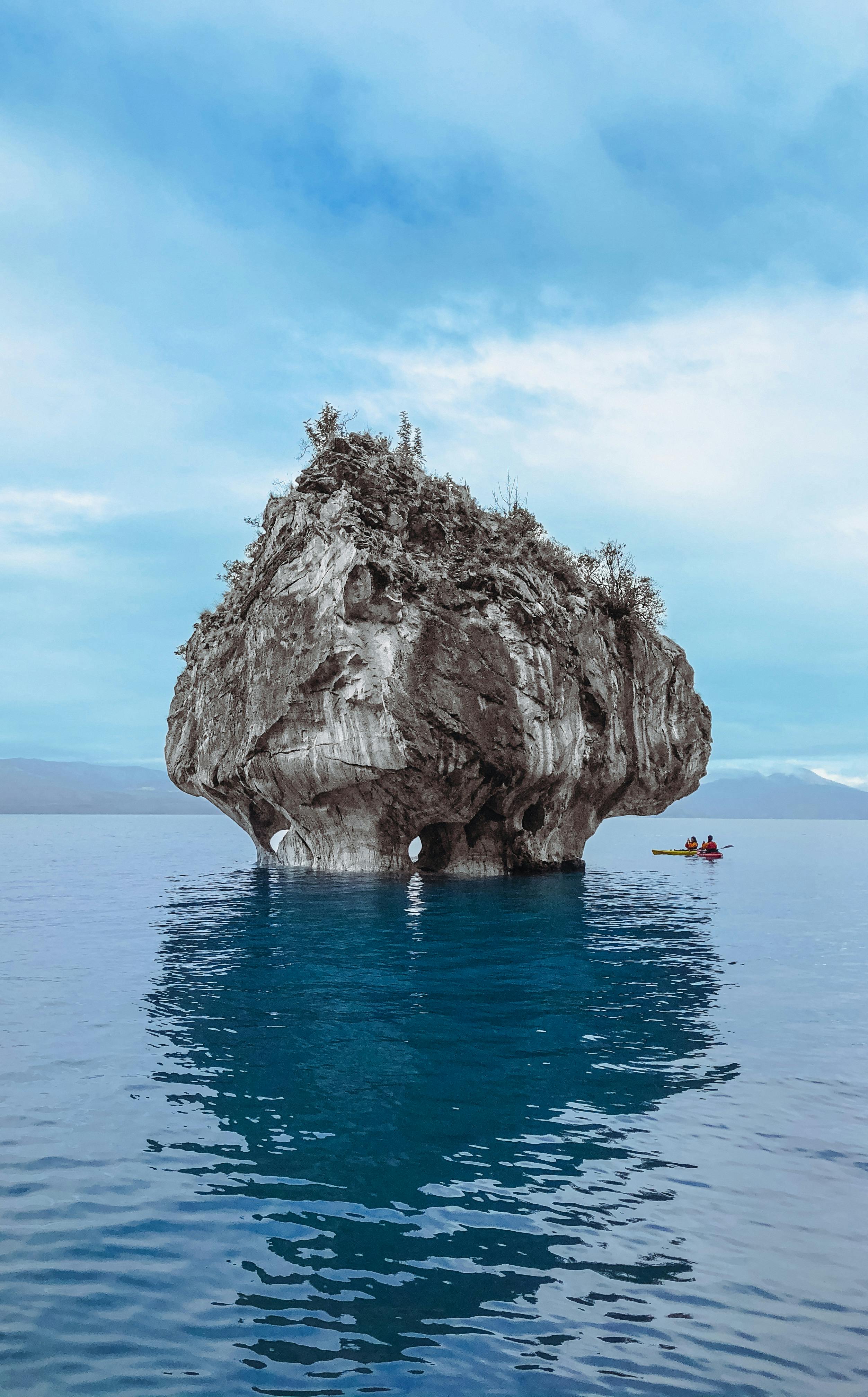 Brown Rock Formation on the Ocean · Free Stock Photo
