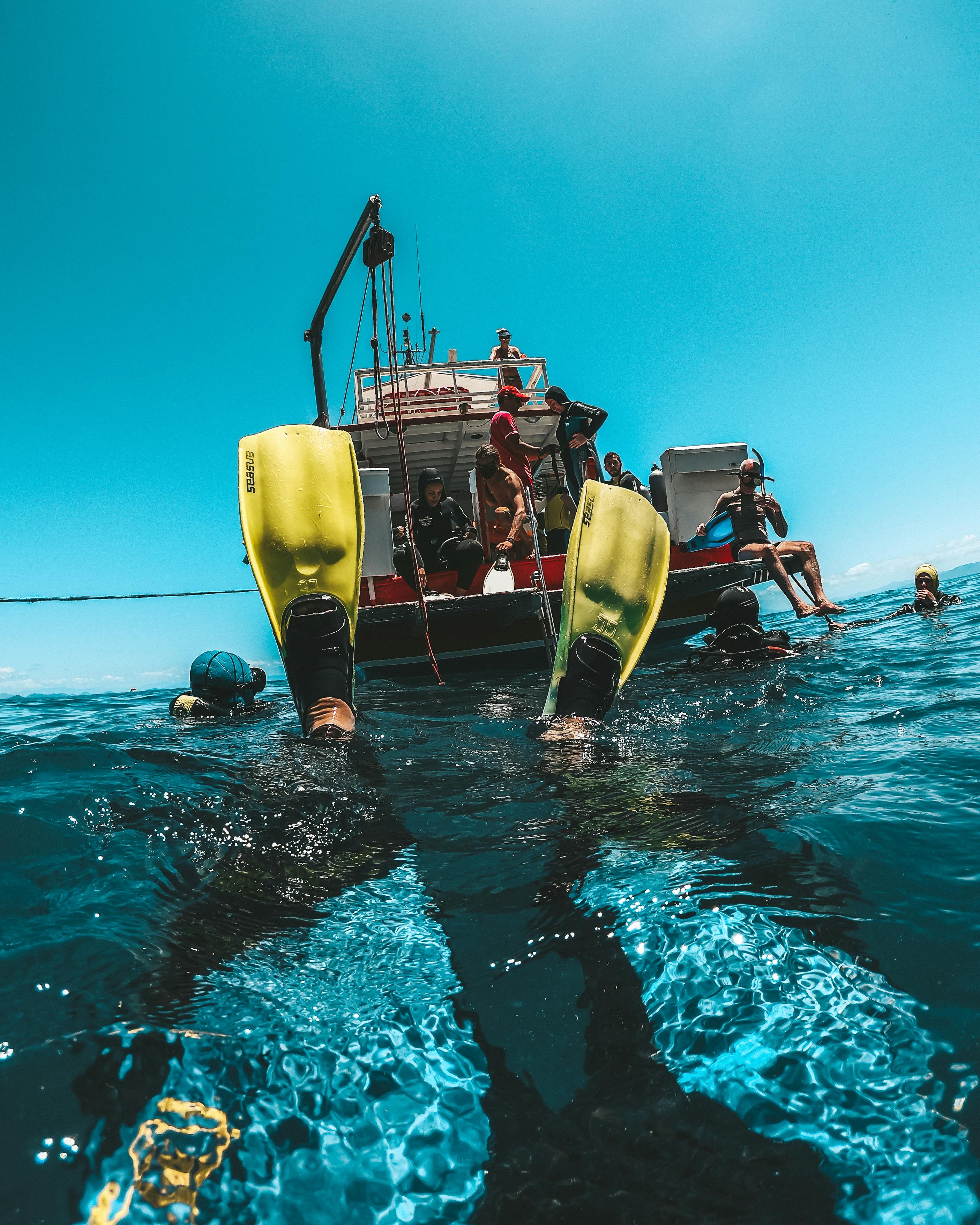 Man Freediving in Sea with Underwater Scooter · Free Stock Photo