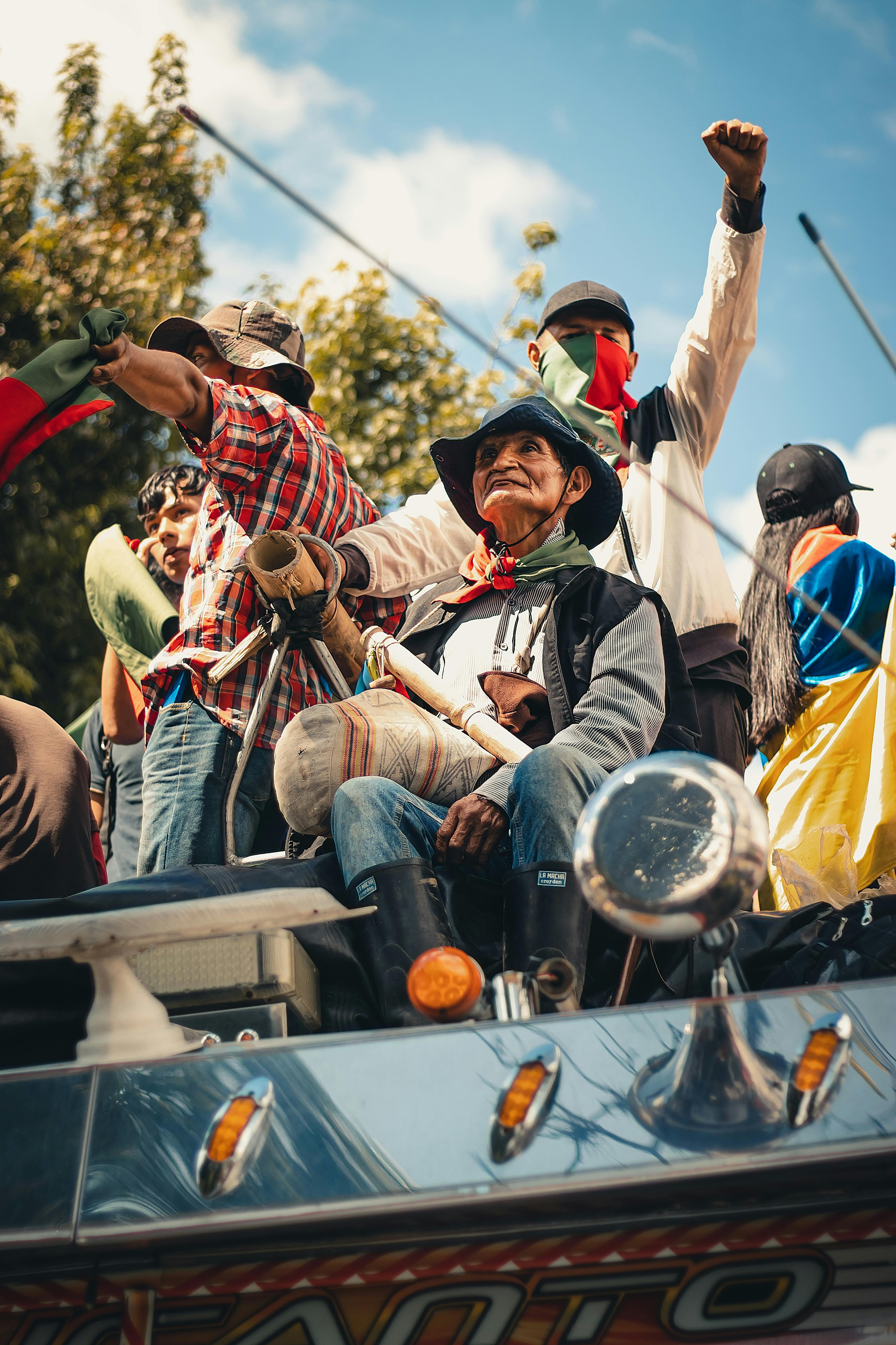 Senior Man Surrounded by a Group of Young People · Free Stock Photo