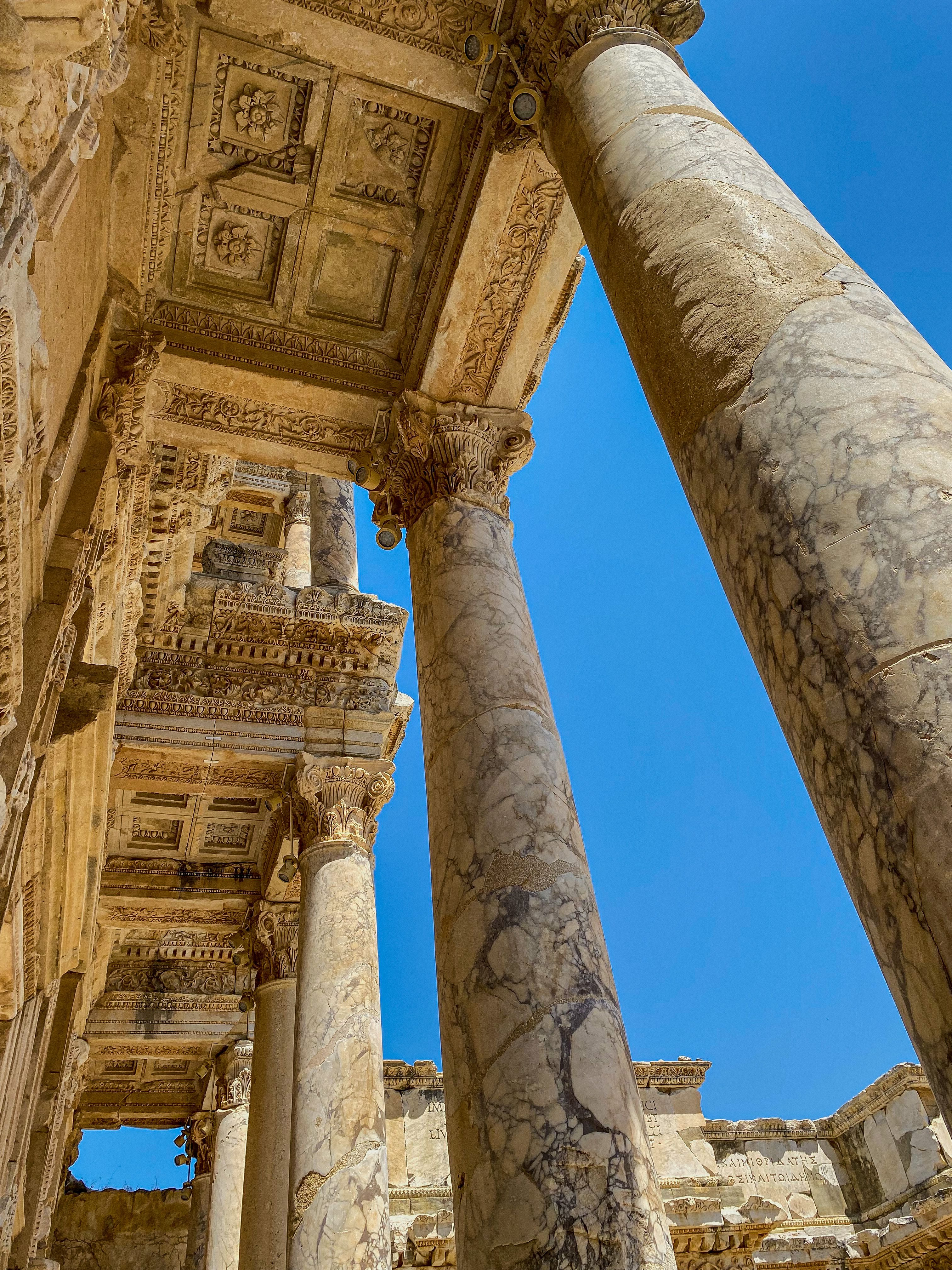 Low Angle Shot of Ruins of the Library of Celsus against Blue Sky ...