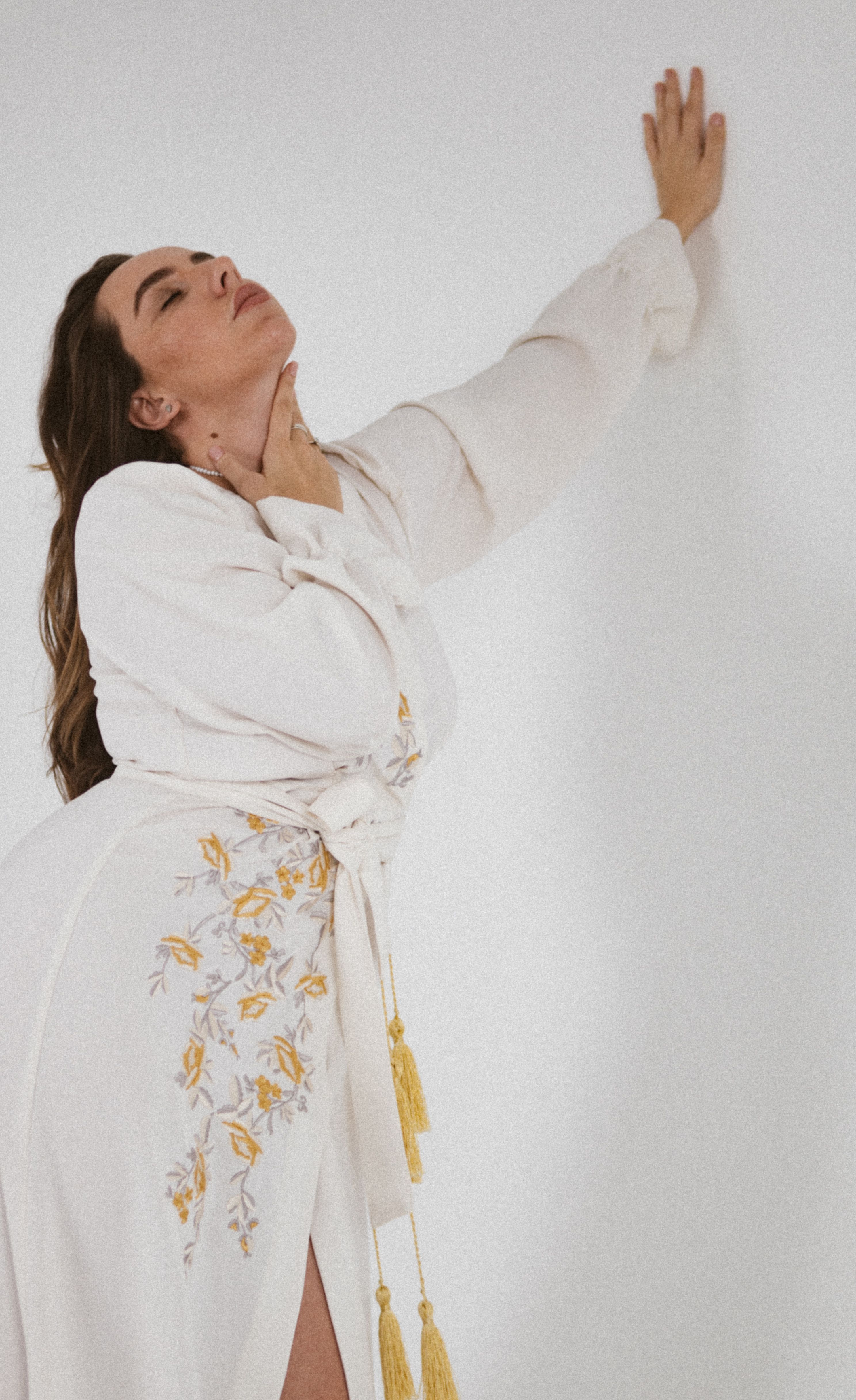 Person in White Robe Walking on Floor Tiles · Free Stock Photo
