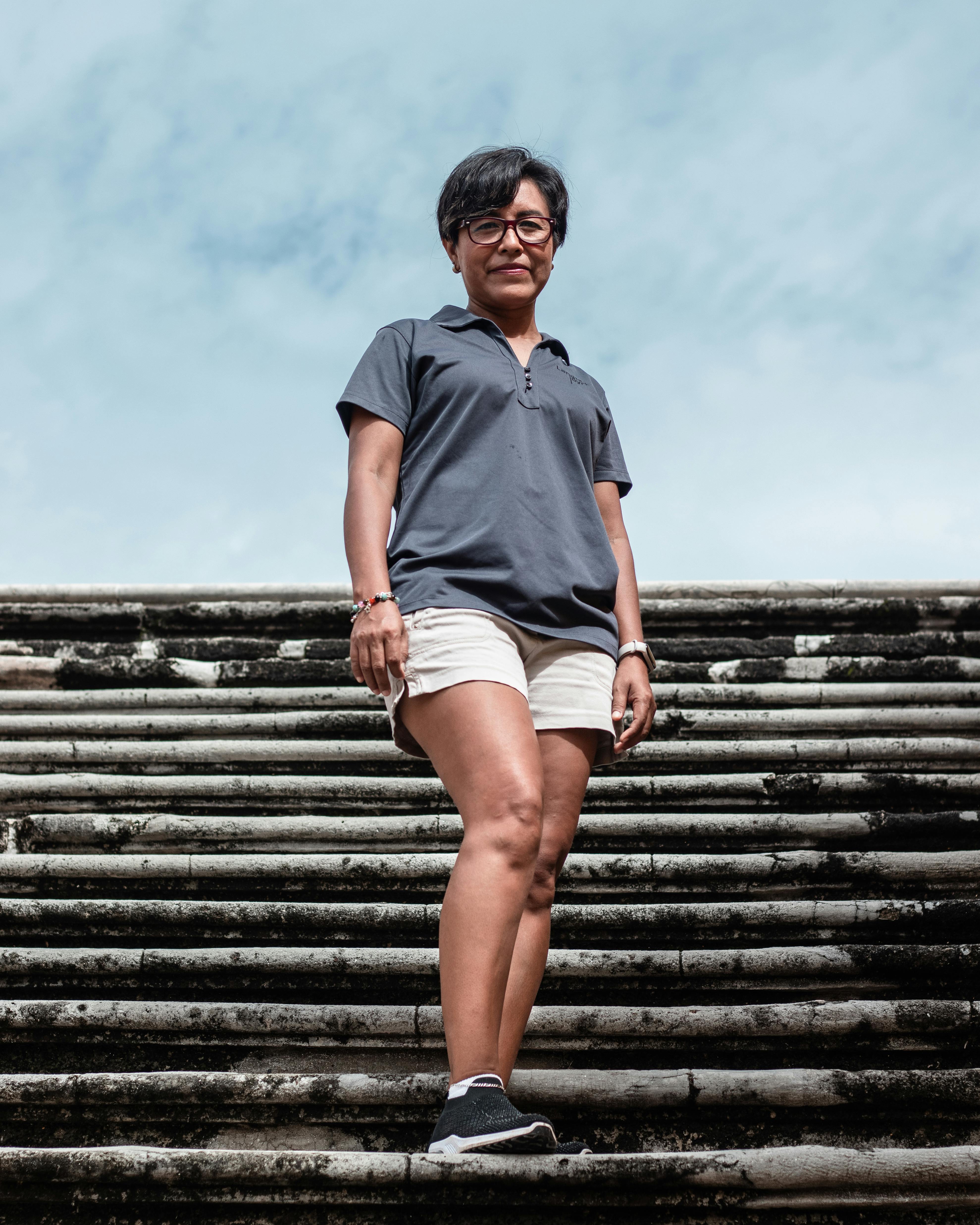 Low Angle Shot of a Woman on the Stairs · Free Stock Photo