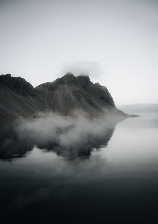 Mountain Beside Calm Body of Water · Free Stock Photo Mountain Beside Calm Body of Water · Free Stock Photo