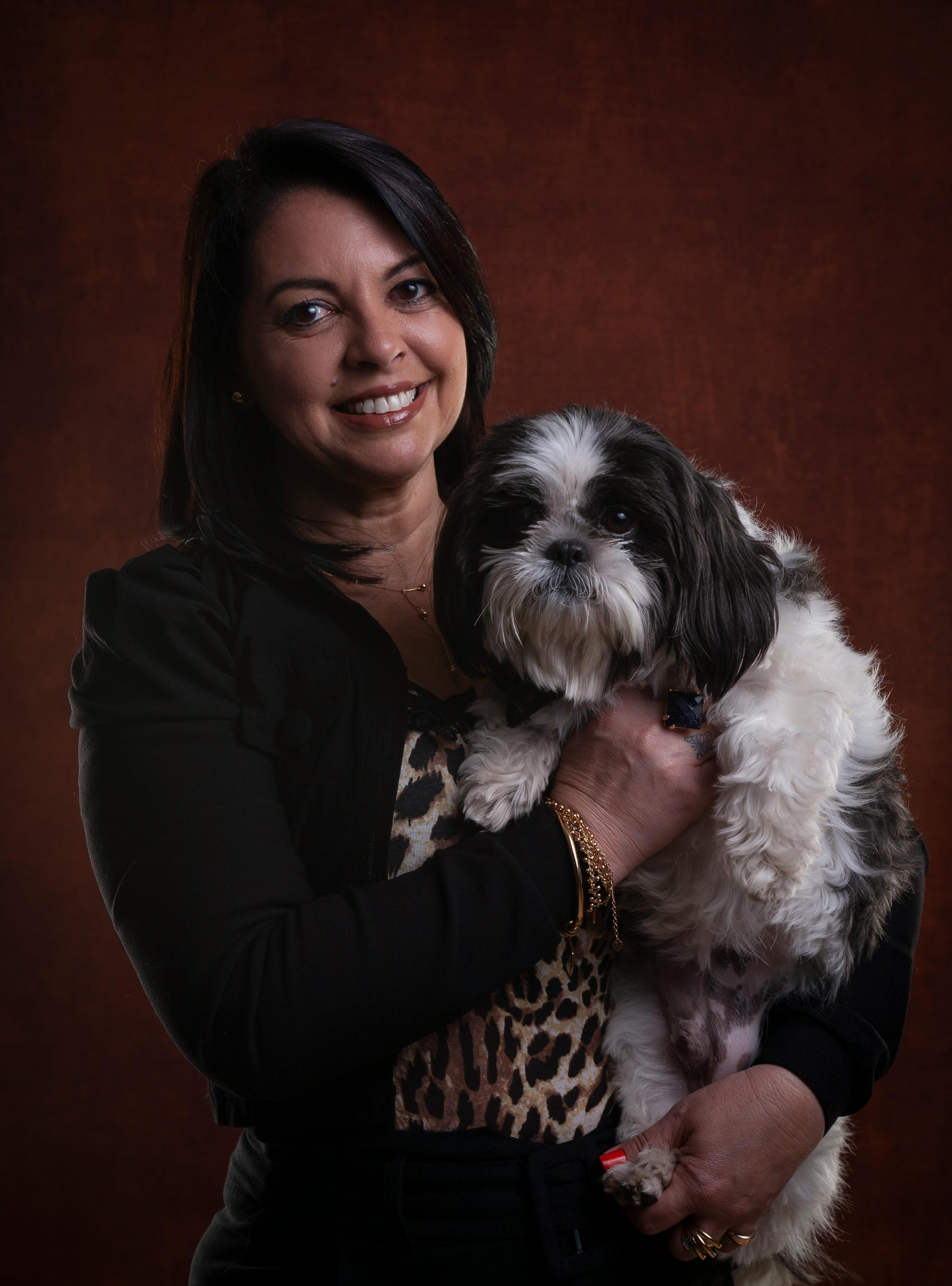 Woman with a Dog Posing in a Studio · Free Stock Photo