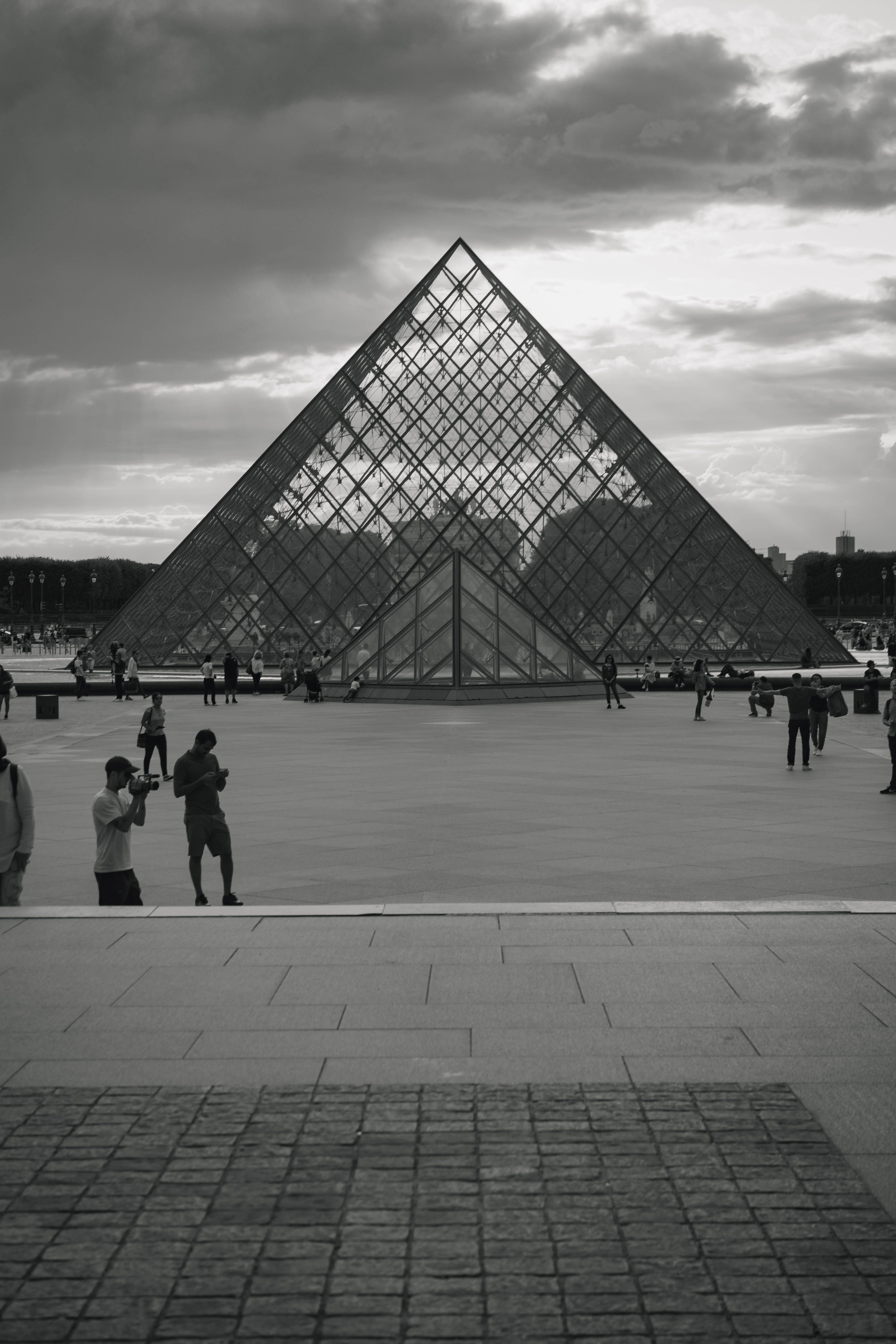 Grayscale Photo of the Louvre Pyramid · Free Stock Photo