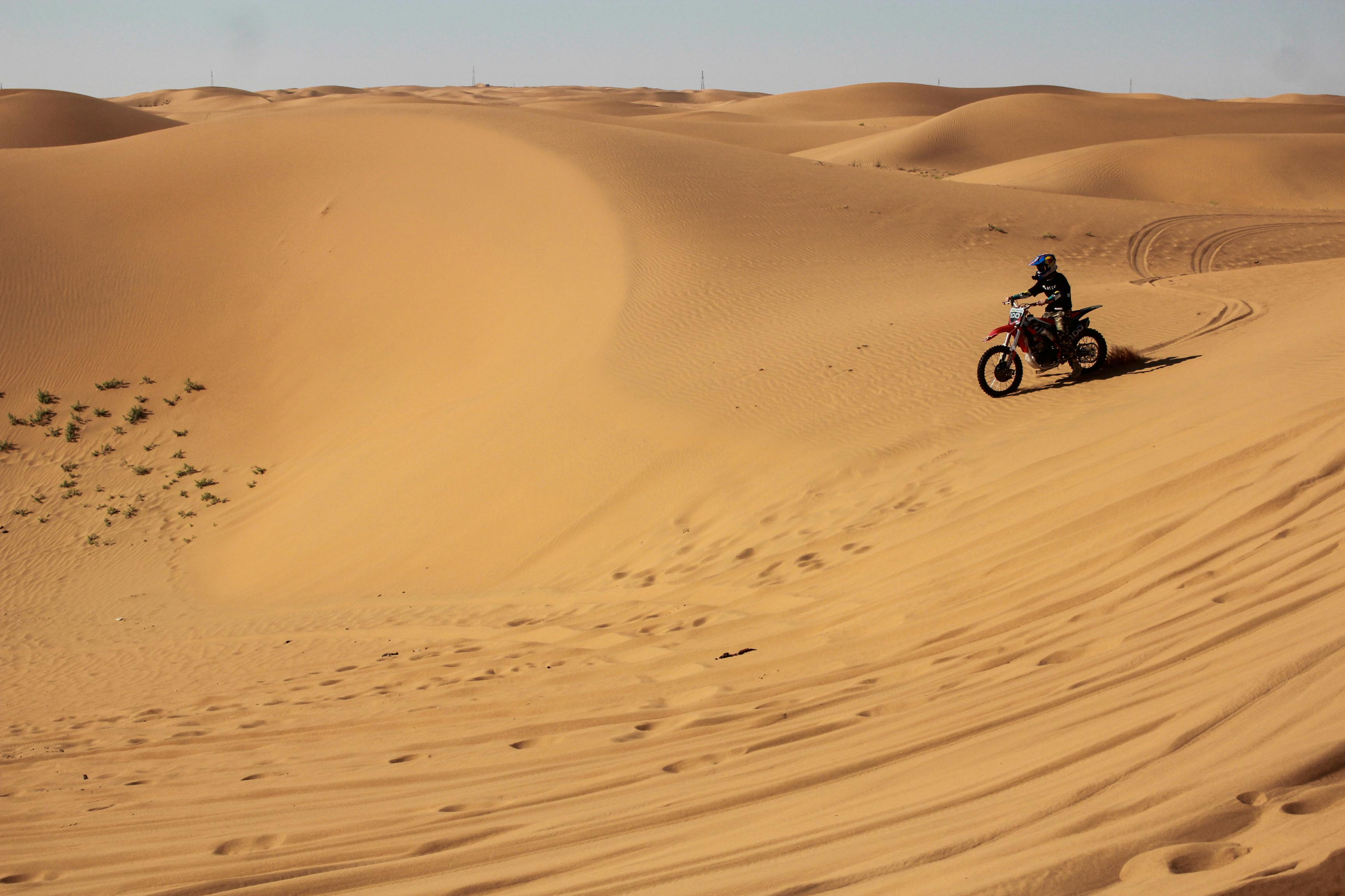 Person Riding a Motorcycle in the Desert · Free Stock Photo