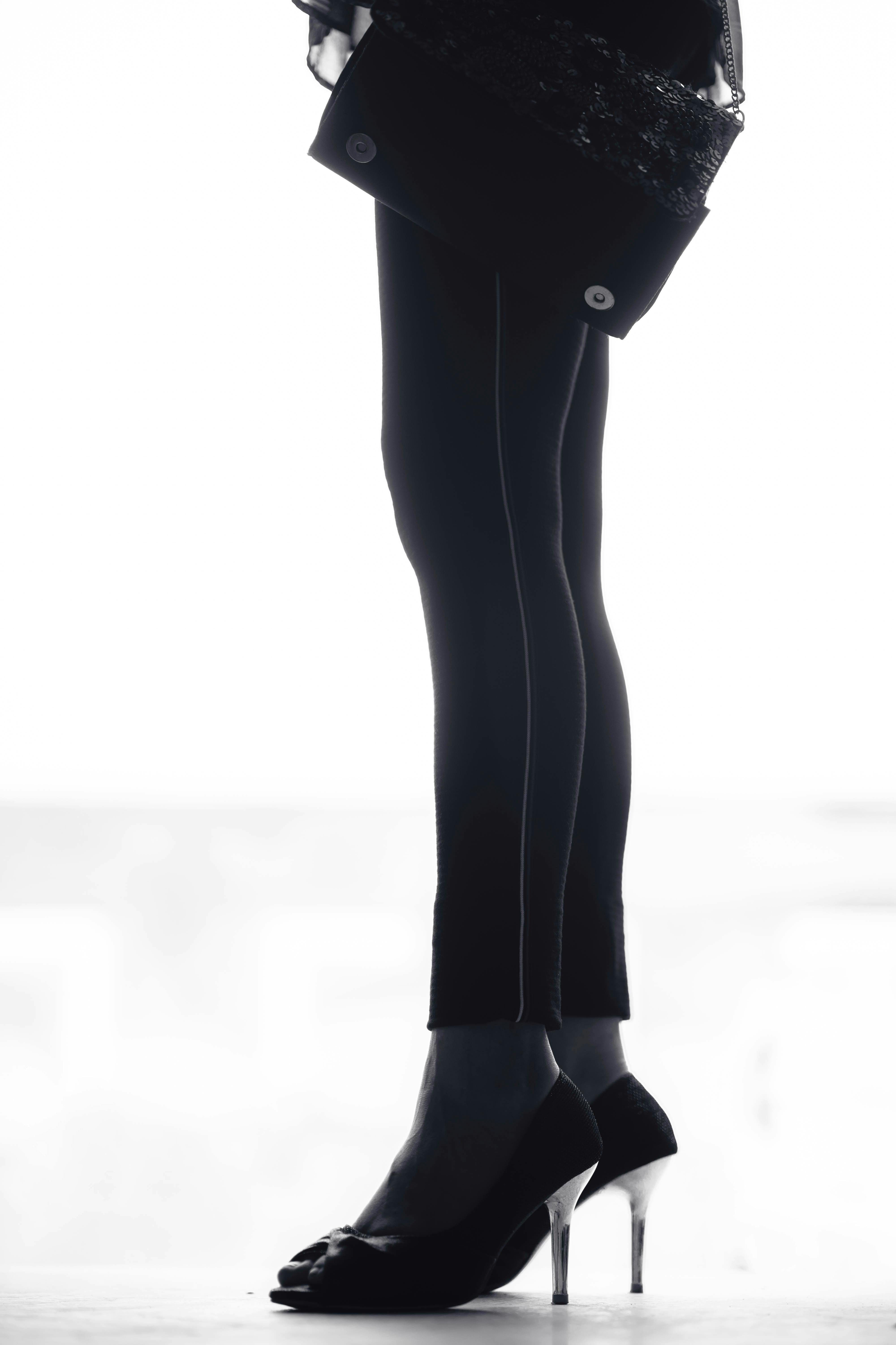 Grayscale Photograph of a Person's Legs · Free Stock Photo