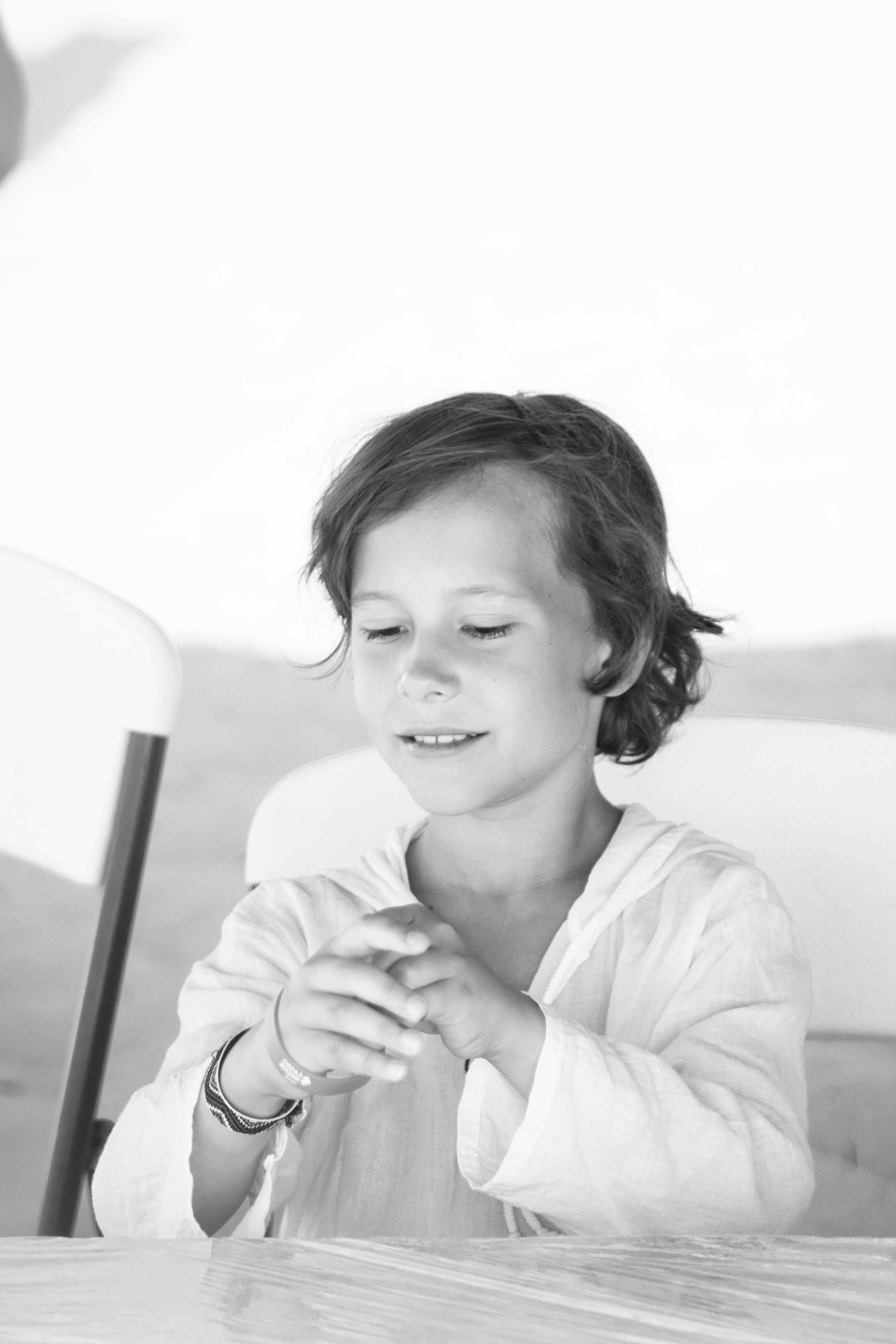 Grayscale Photo Of a Boy Crying · Free Stock Photo
