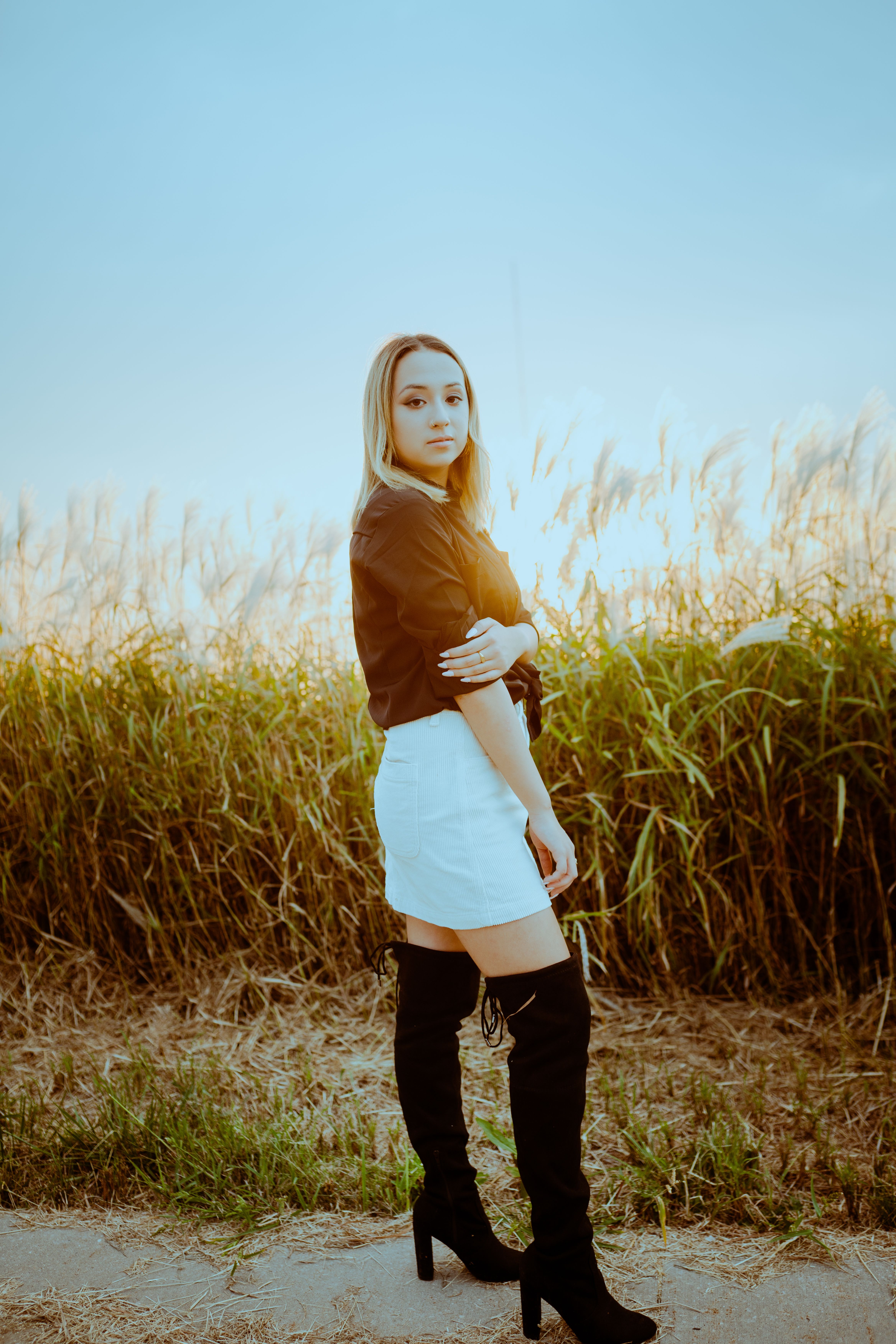 Photo of a Woman in Black Boots Posing · Free Stock Photo