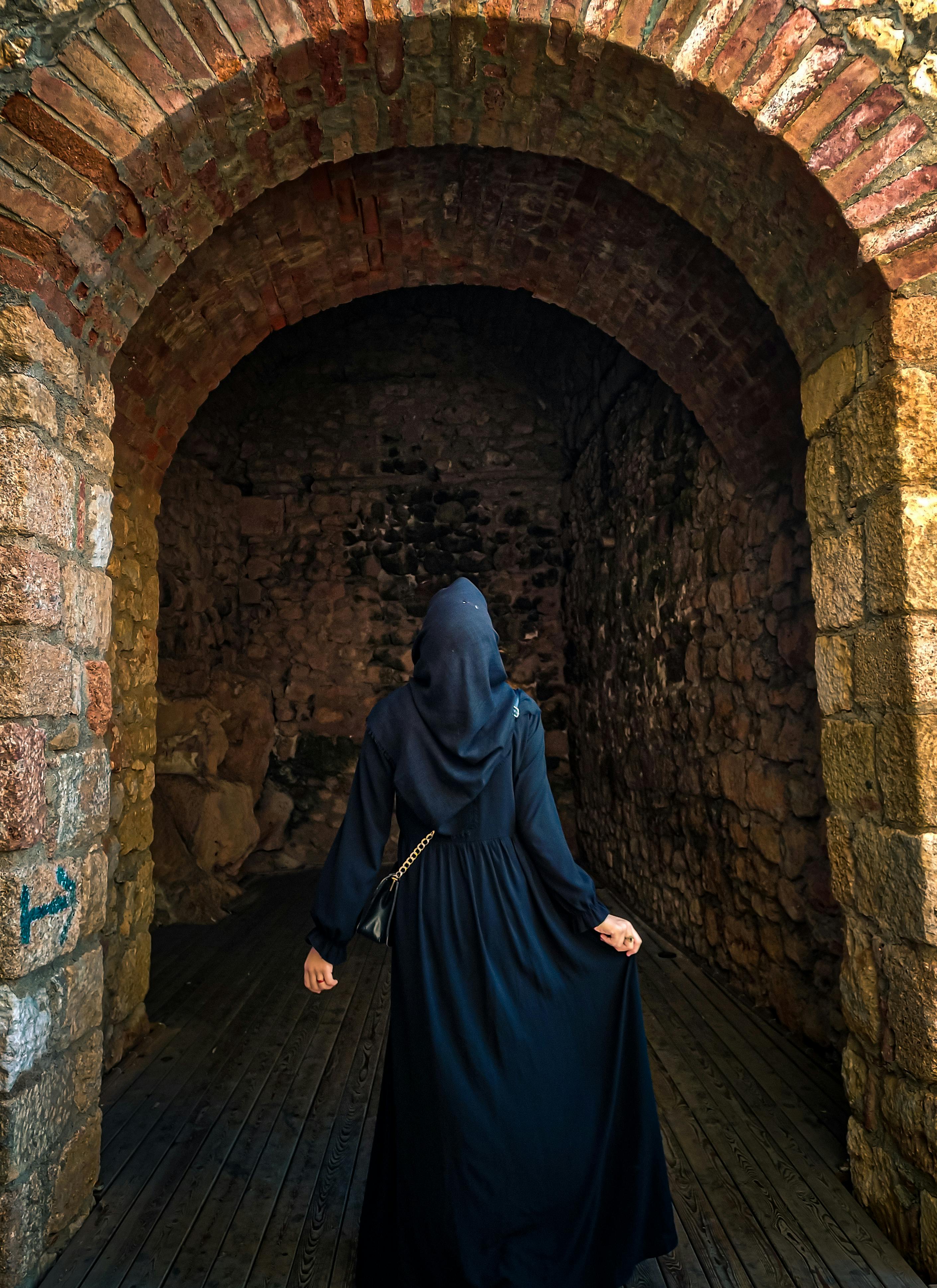 Back View of a Woman Black Sweater and Black Cap · Free Stock Photo