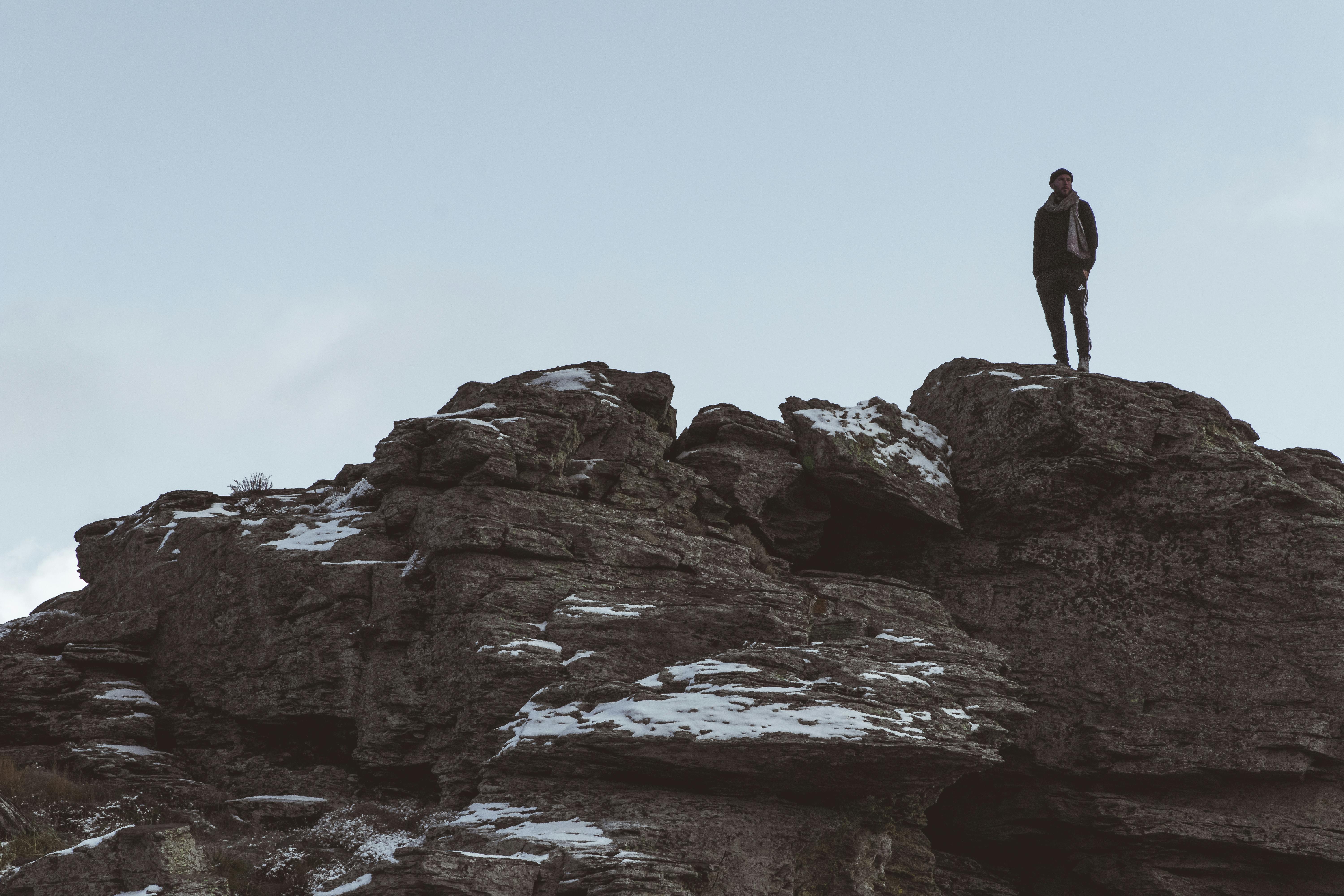 A Man Standing on the Rock · Free Stock Photo