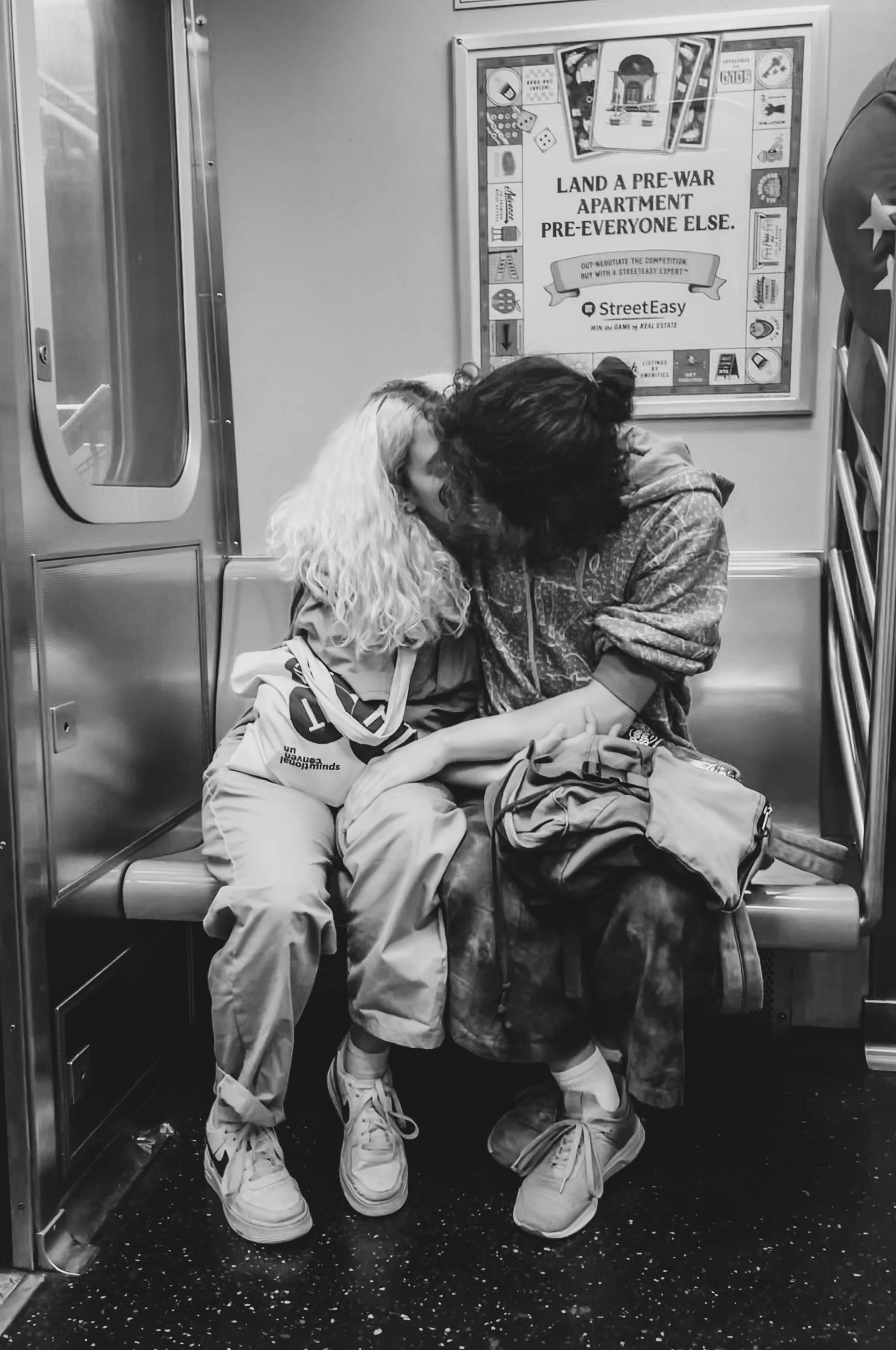 People Sitting on Bench at a Bus Stop · Free Stock Photo