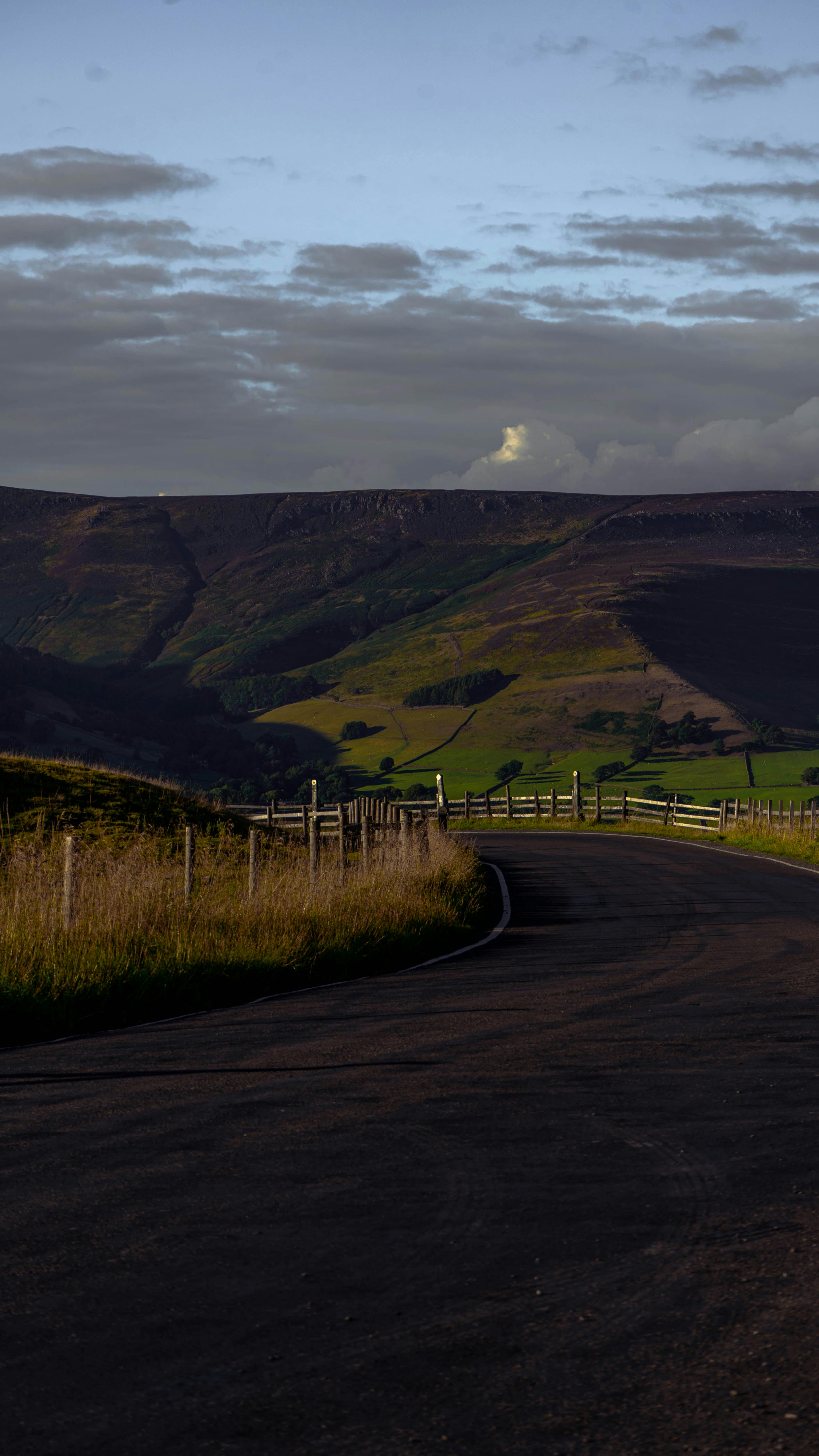Asphalt Road Between Grass Fields · Free Stock Photo