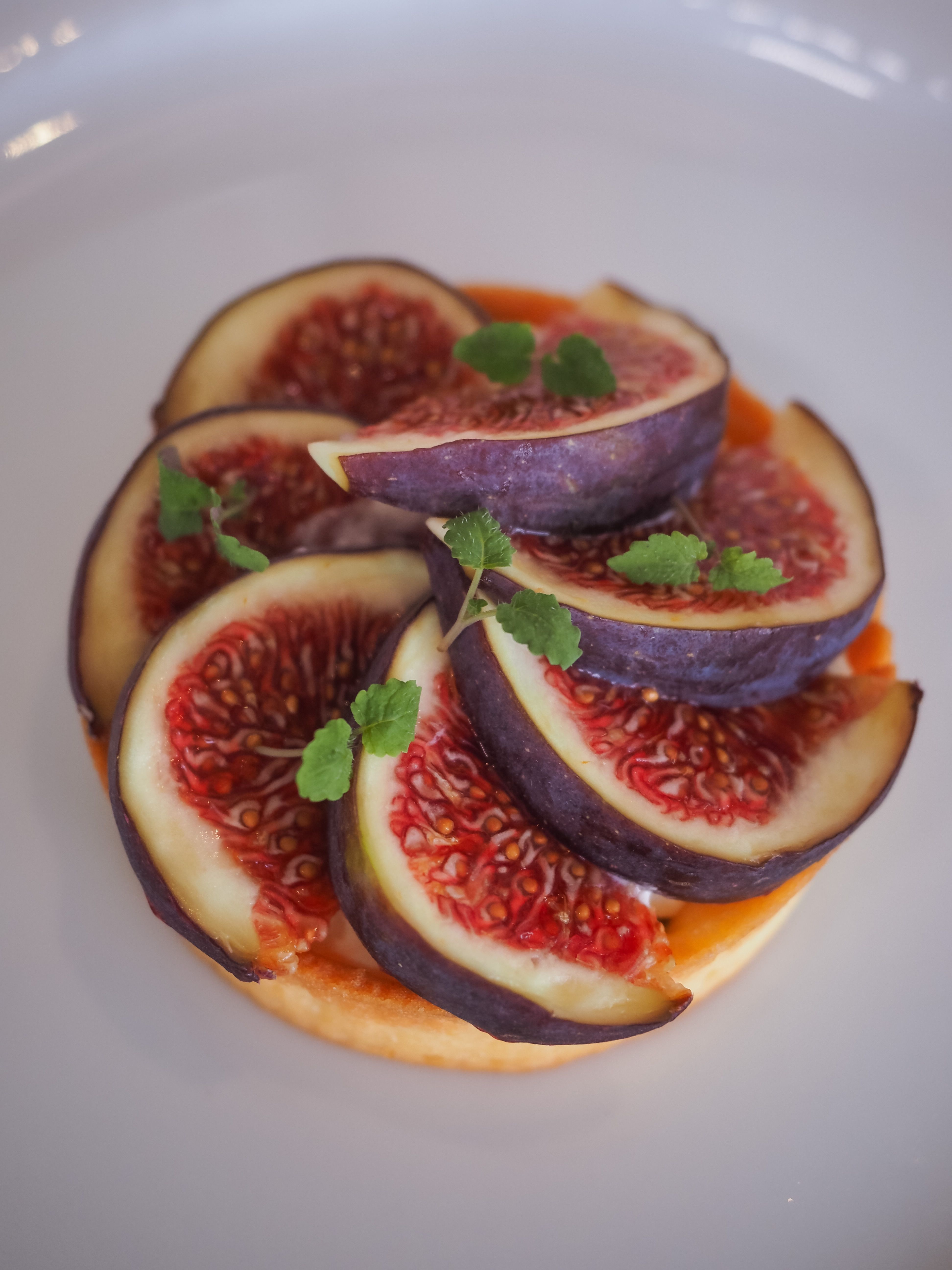 Photo of Slices of Fig on a White Plate · Free Stock Photo