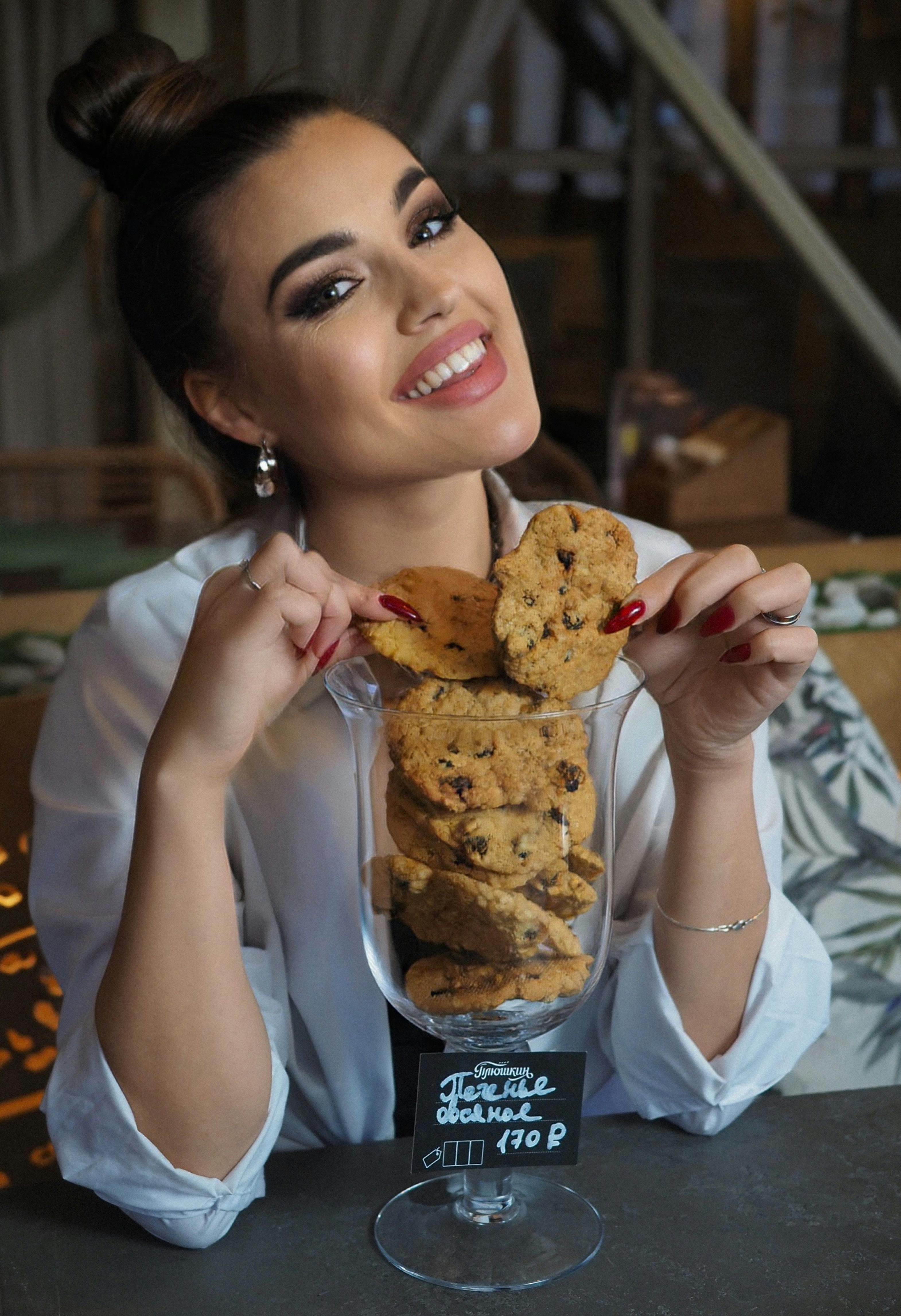 Beautiful Woman Holding Cookies · Free Stock Photo