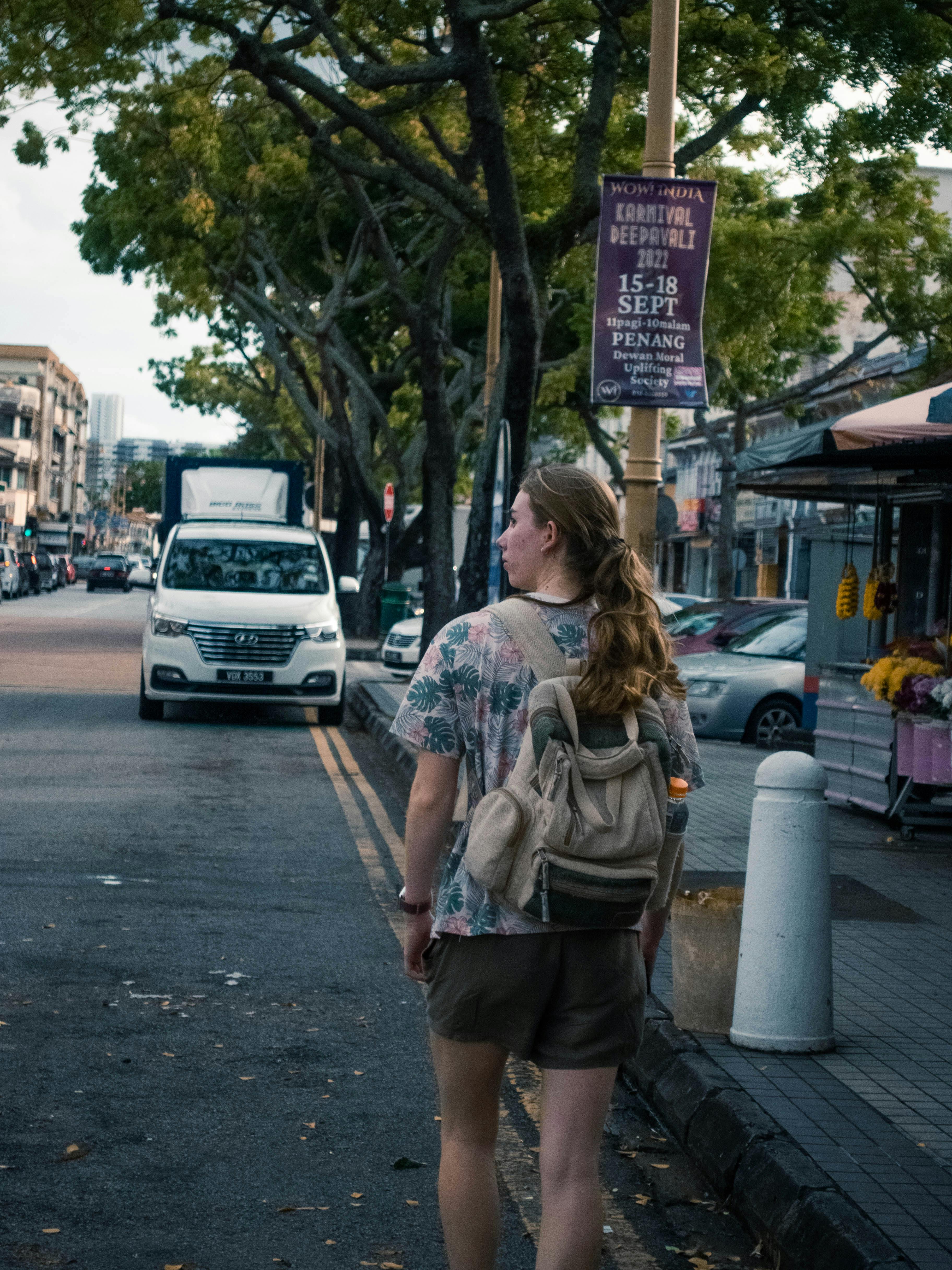 A Back View of People Walking on the Street · Free Stock Photo