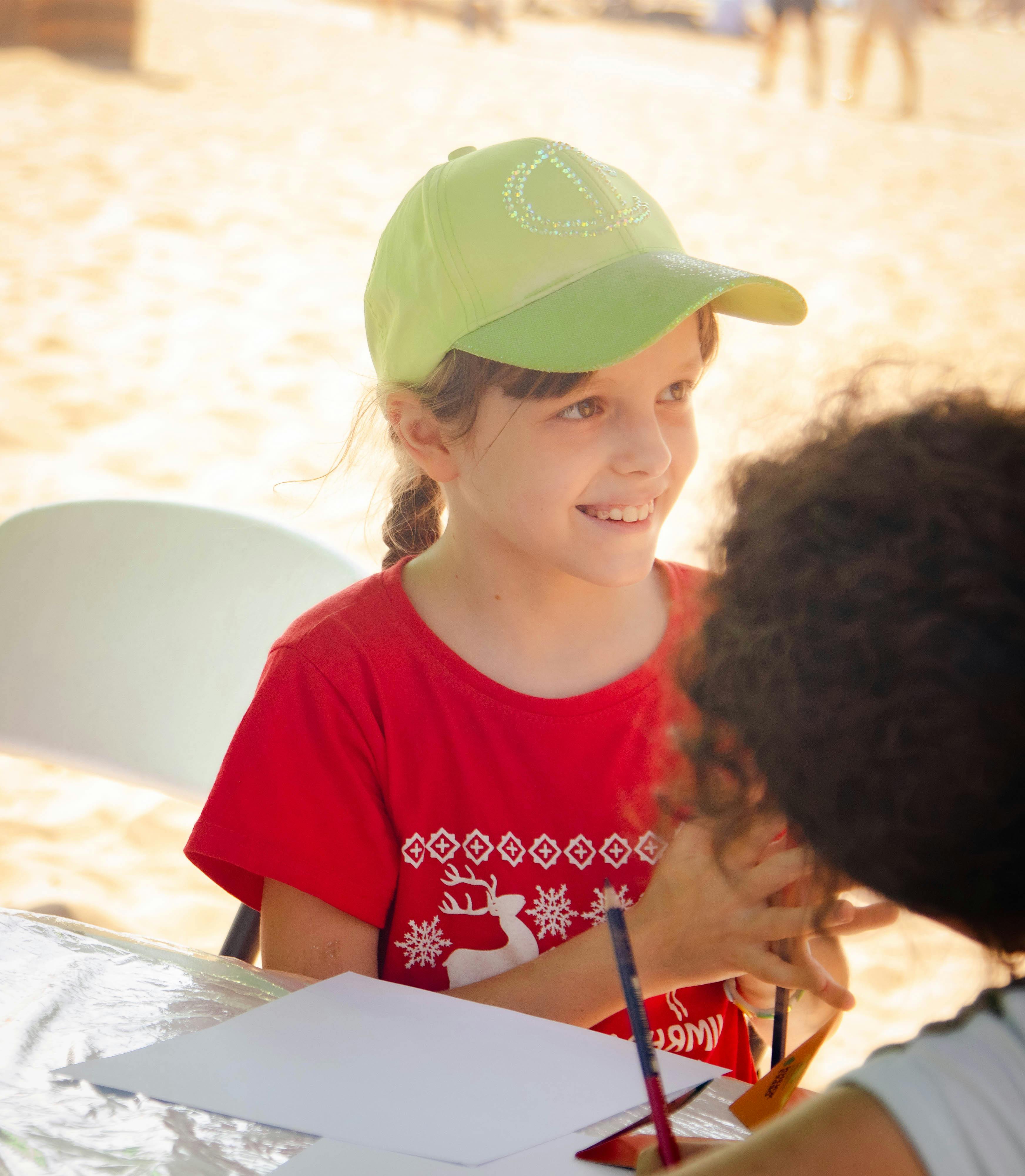Photo of a Girl with a Green Cap · Free Stock Photo