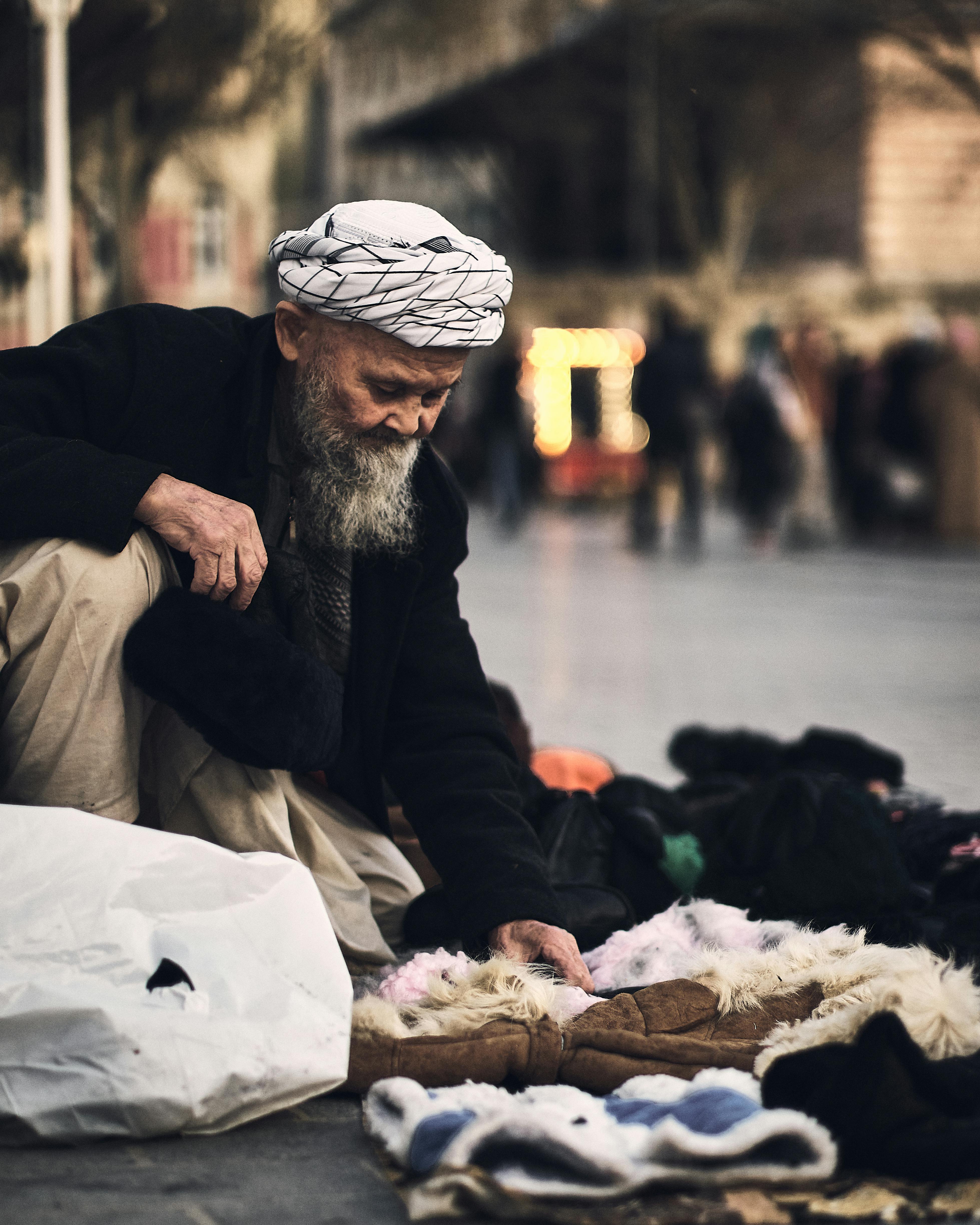 Old Bearded Man Selling on Street · Free Stock Photo