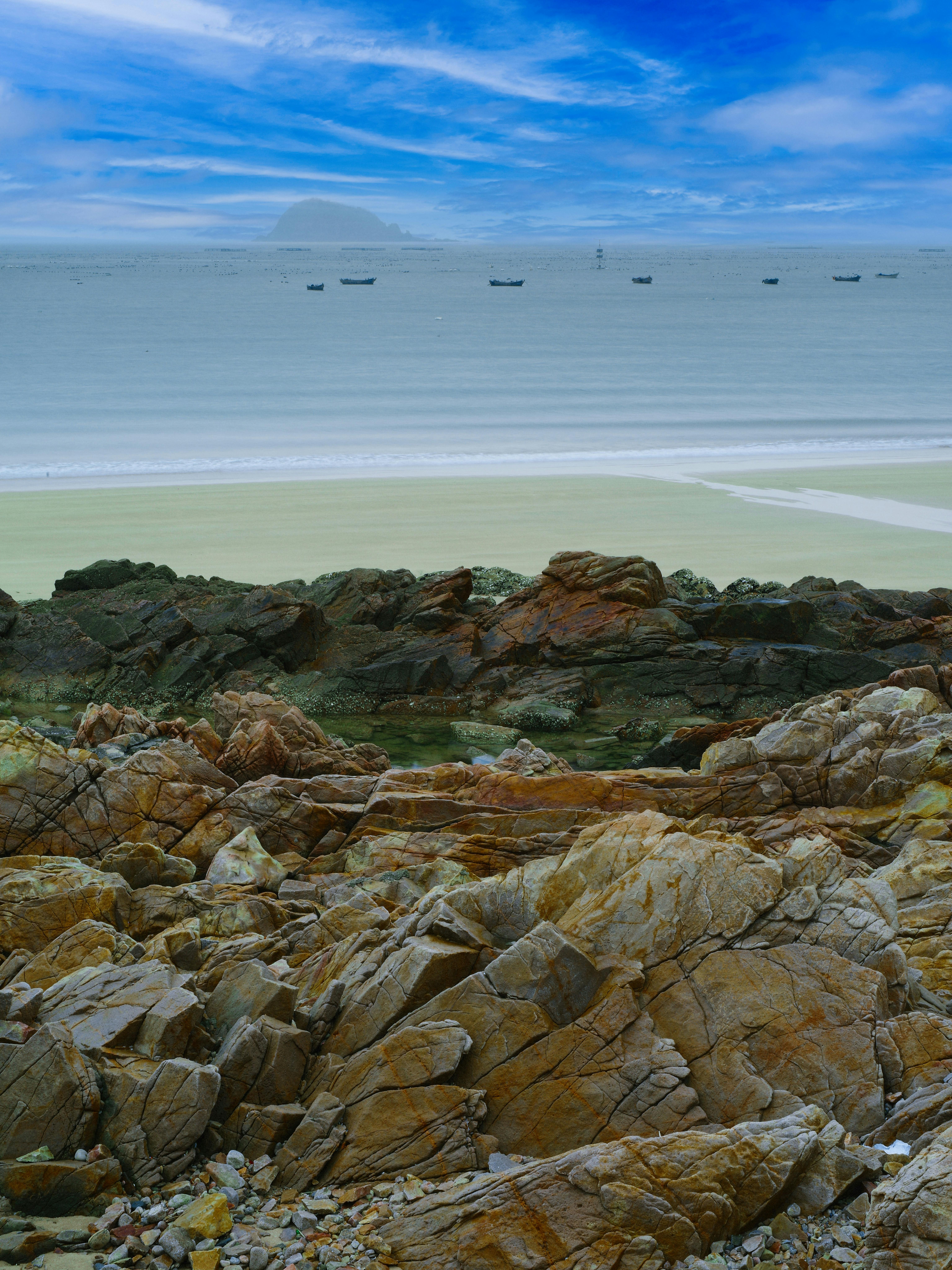 Rocky Beach and Ships in the Horizon · Free Stock Photo