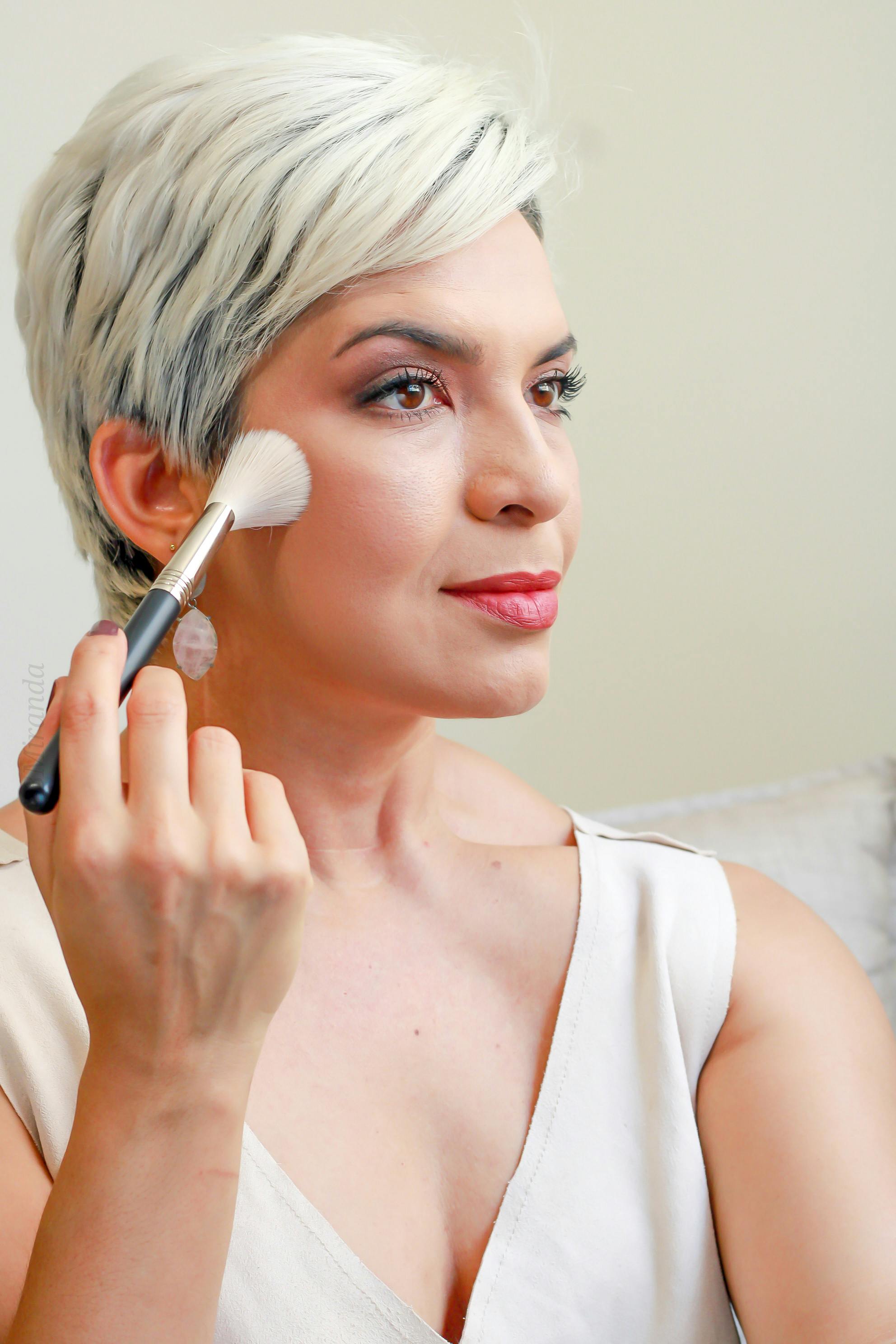A Woman using Makeup Brush · Free Stock Photo
