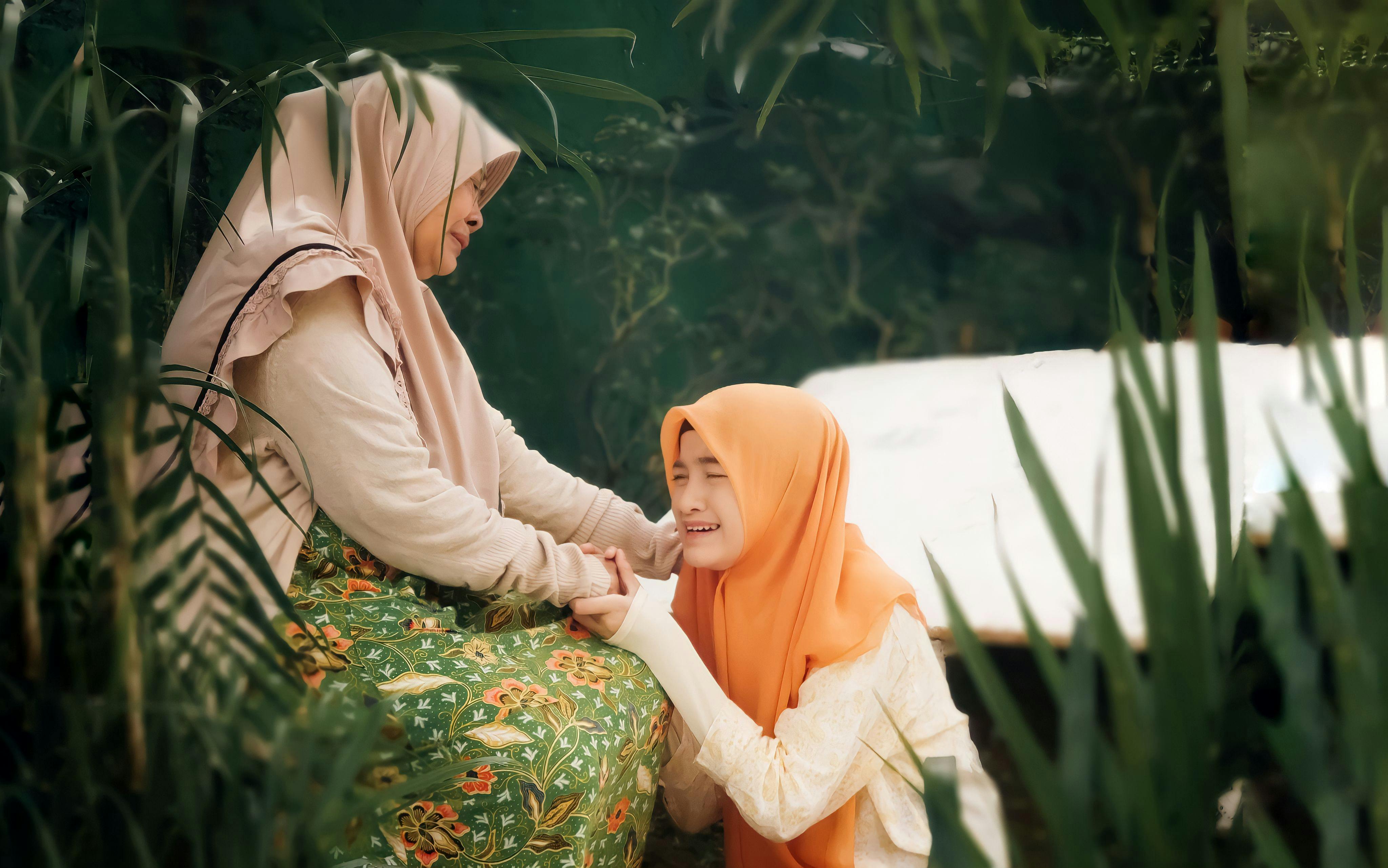 Women in Hijab Crying Together · Free Stock Photo