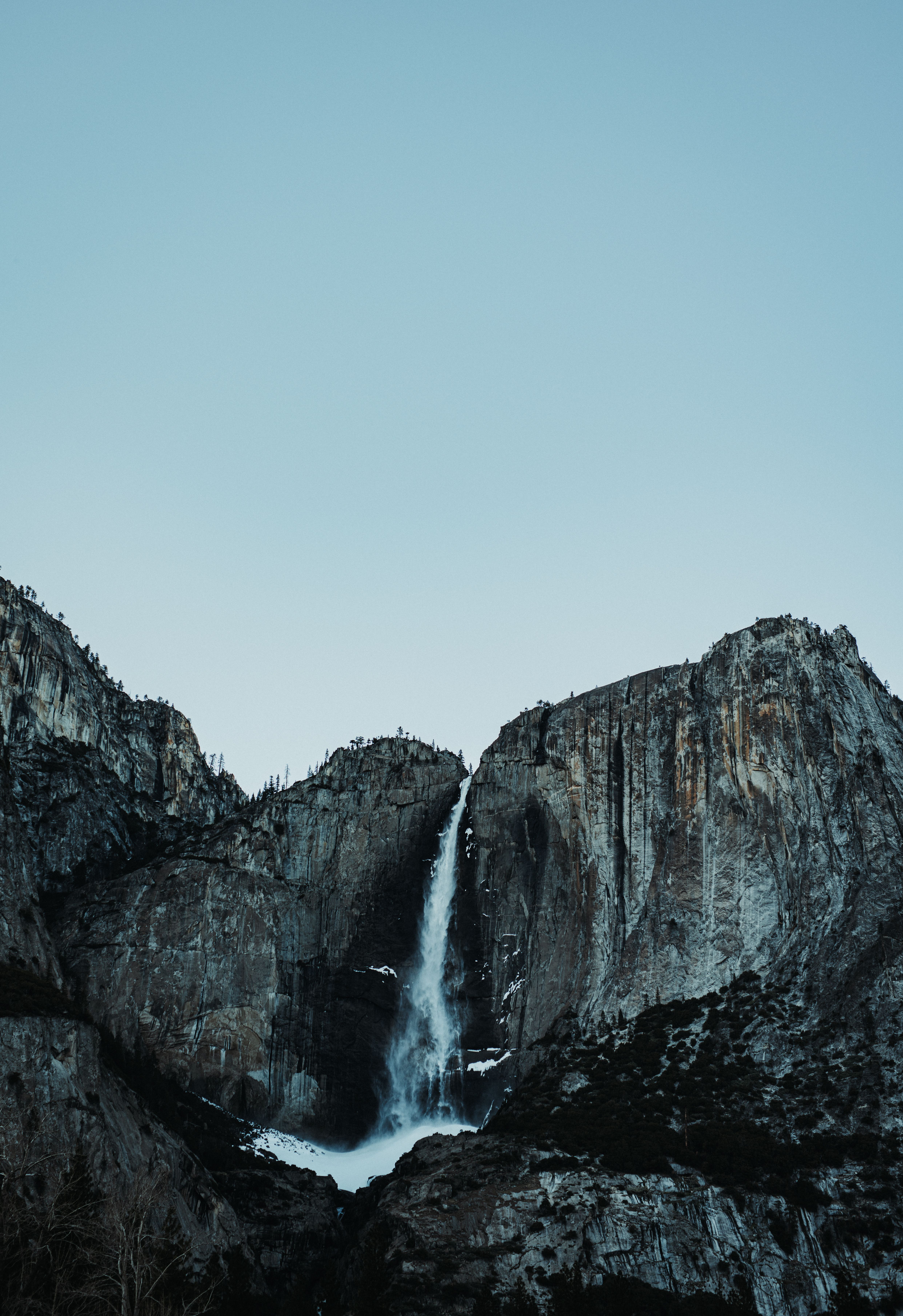 Waterfalls Cascading Down the Cliff of a Rocky Mountain · Free Stock Photo