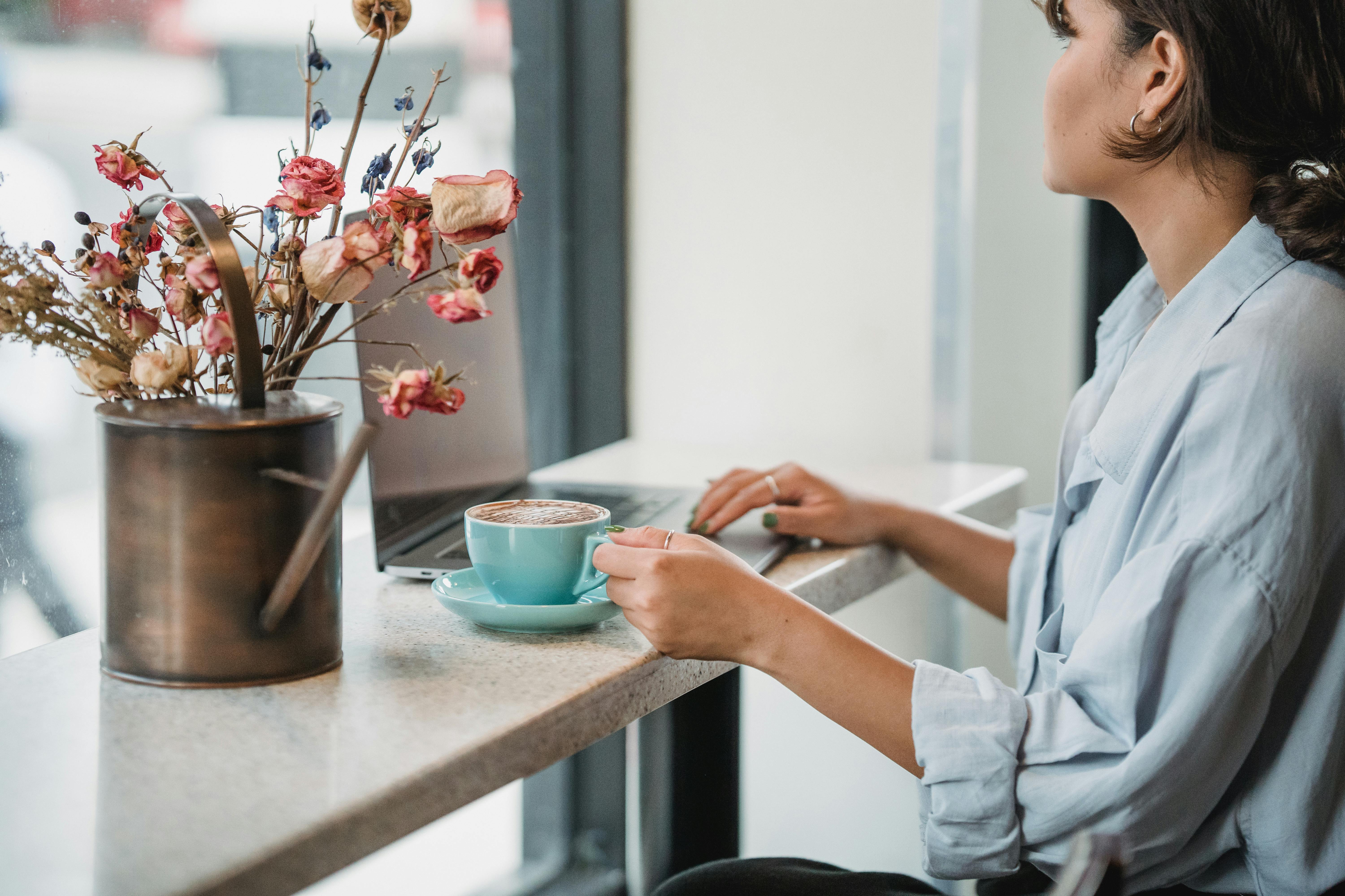 Brunette Woman Enjoy Coffee in Cafe · Free Stock Photo