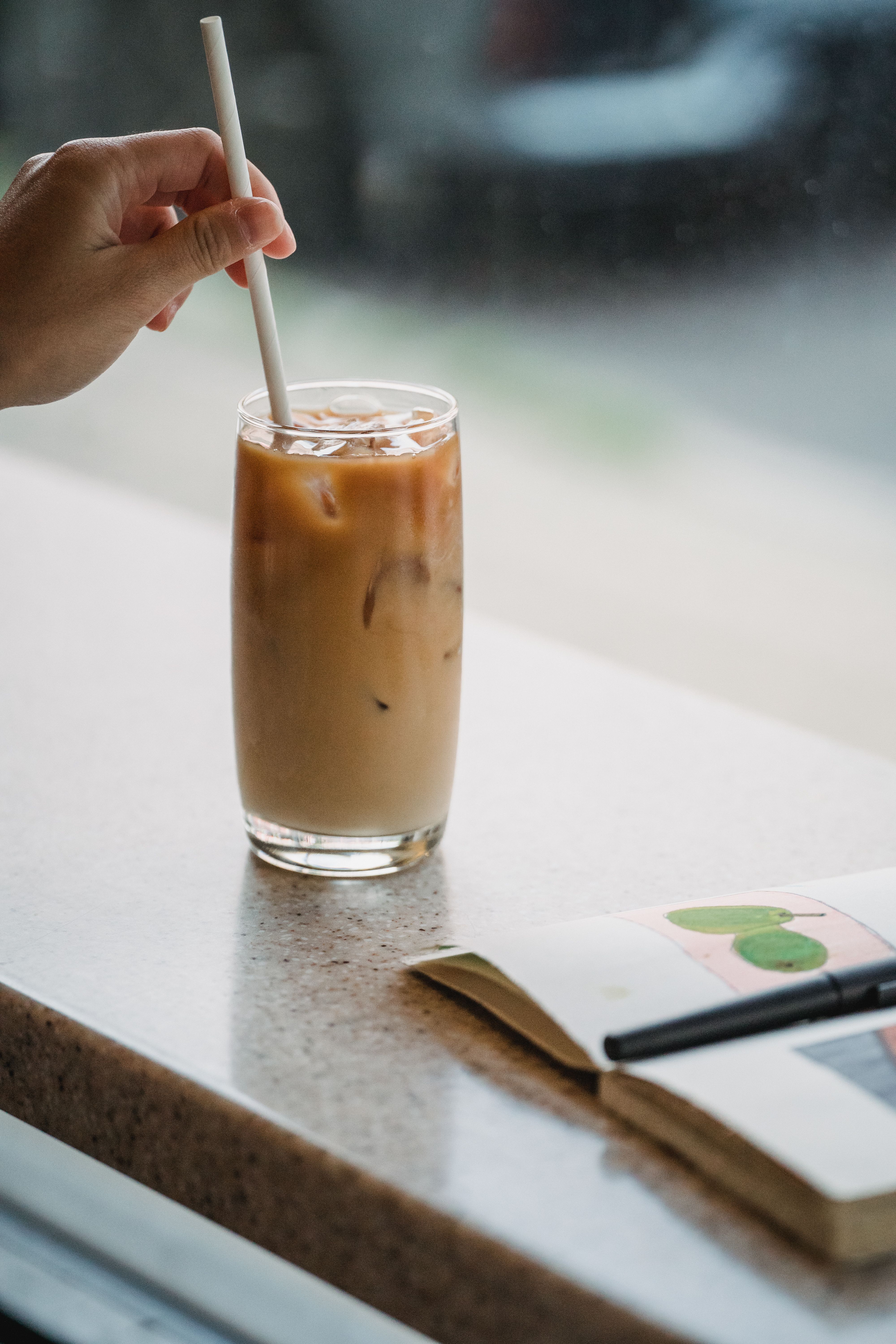 Close Up of Barista Hands Preparing Iced Coffee · Free Stock Photo