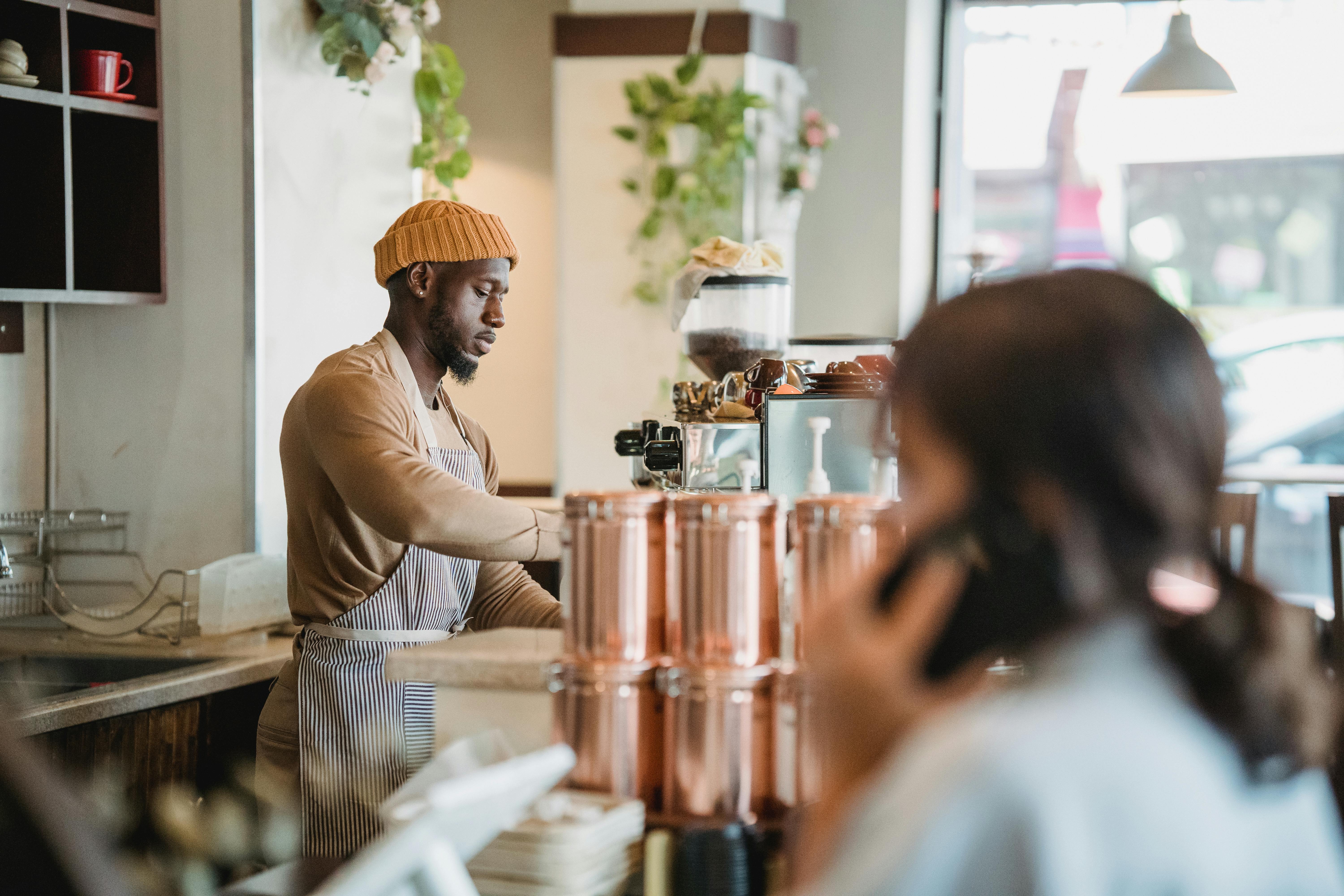 Woman Ordering Coffee in Cafe · Free Stock Photo