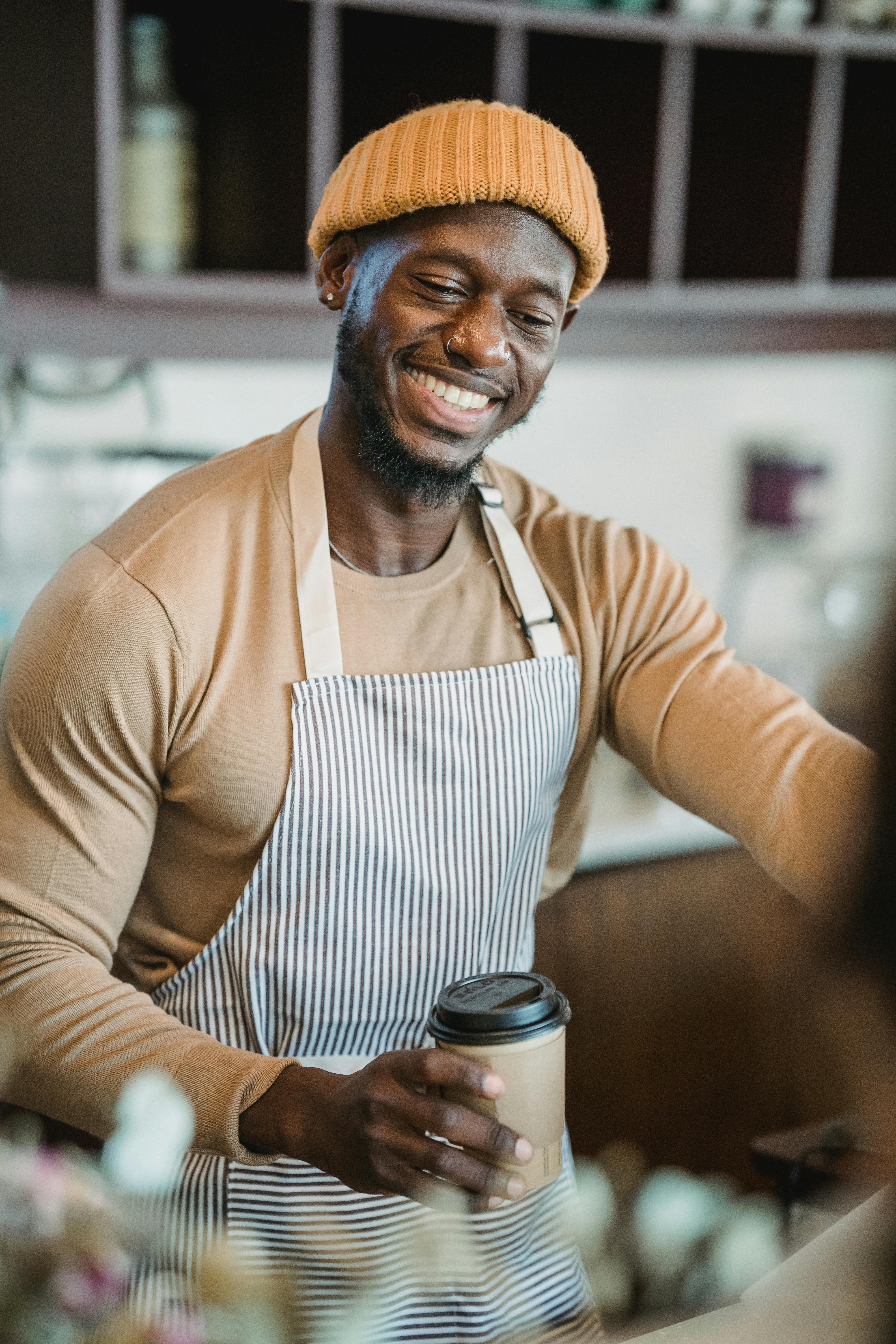 Barista in Cafe Wearing Apron and Hat · Free Stock Photo
