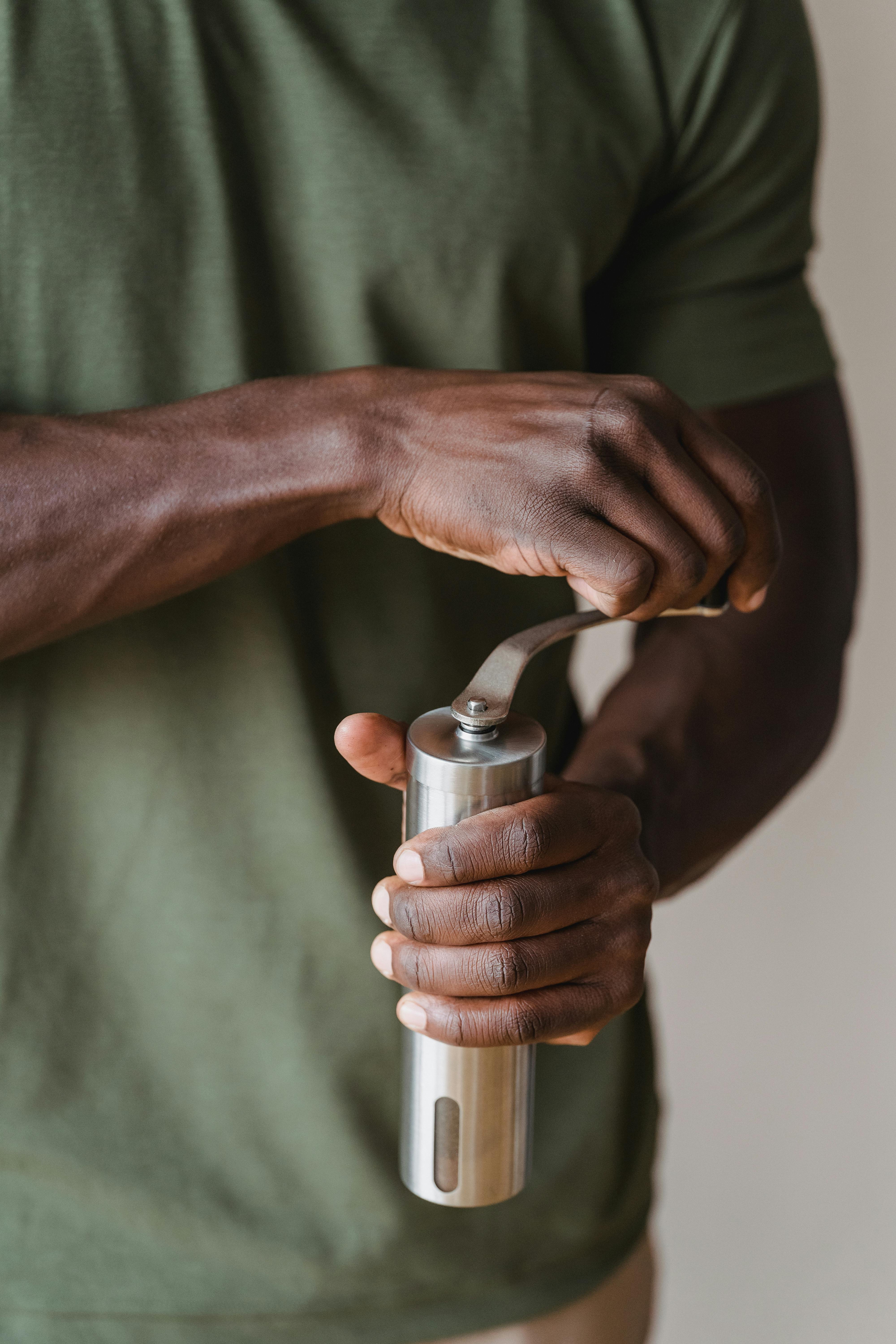 Man Hands Holding Salt Dispenser · Free Stock Photo
