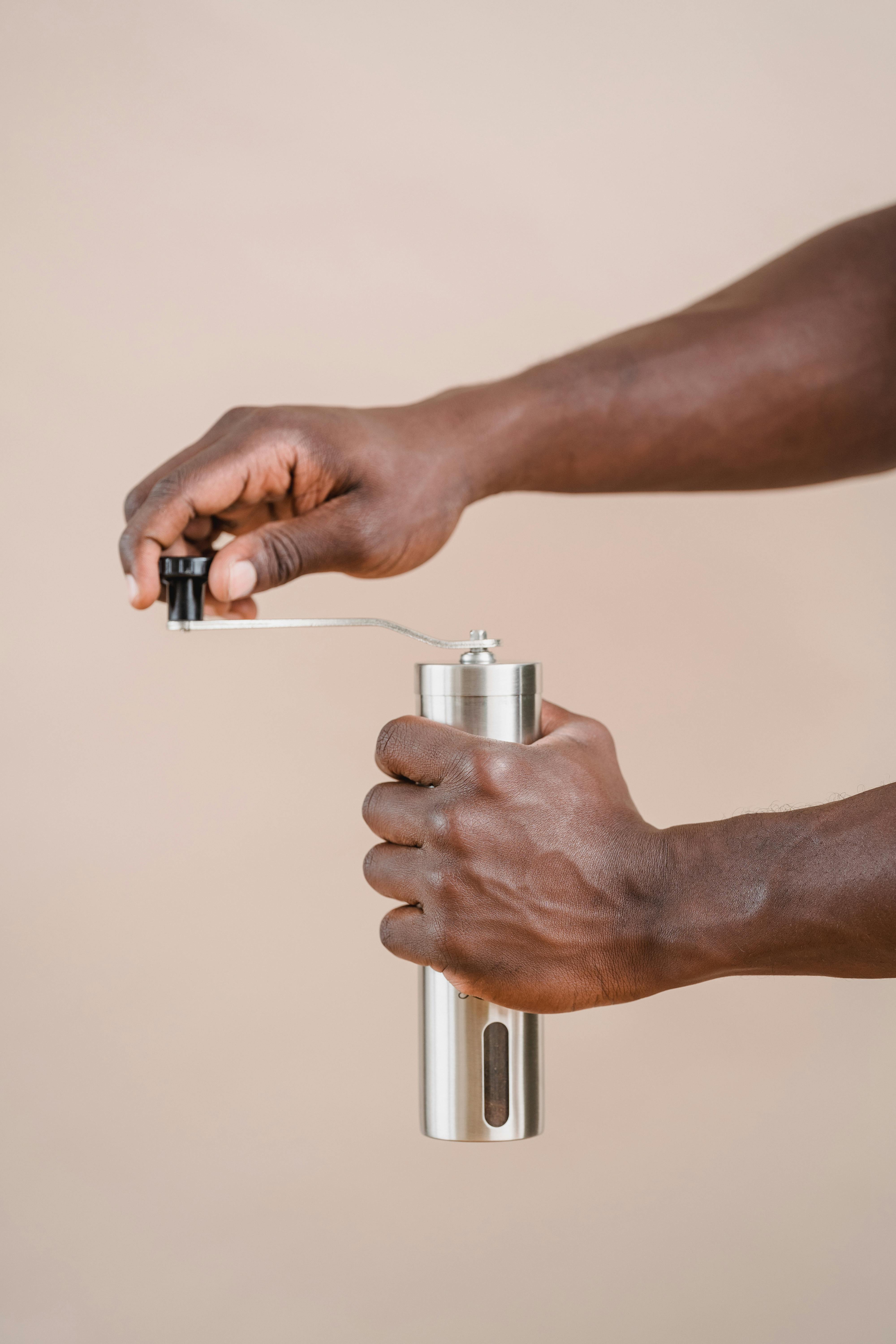 Man Hands Holding Salt Dispenser · Free Stock Photo