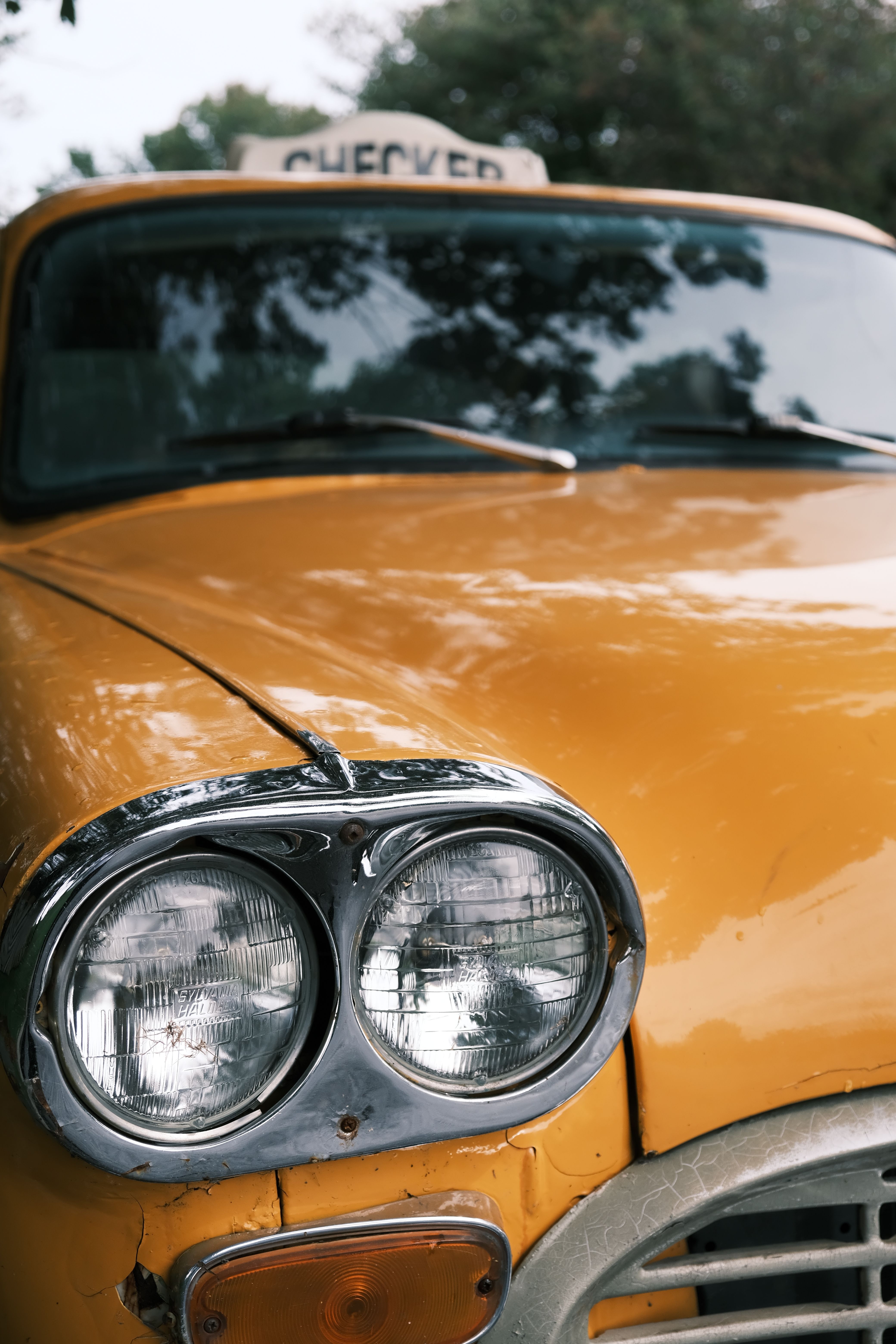 Classic Gray Chevrolet Car Near Us Flag Inside Garage · Free Stock Photo