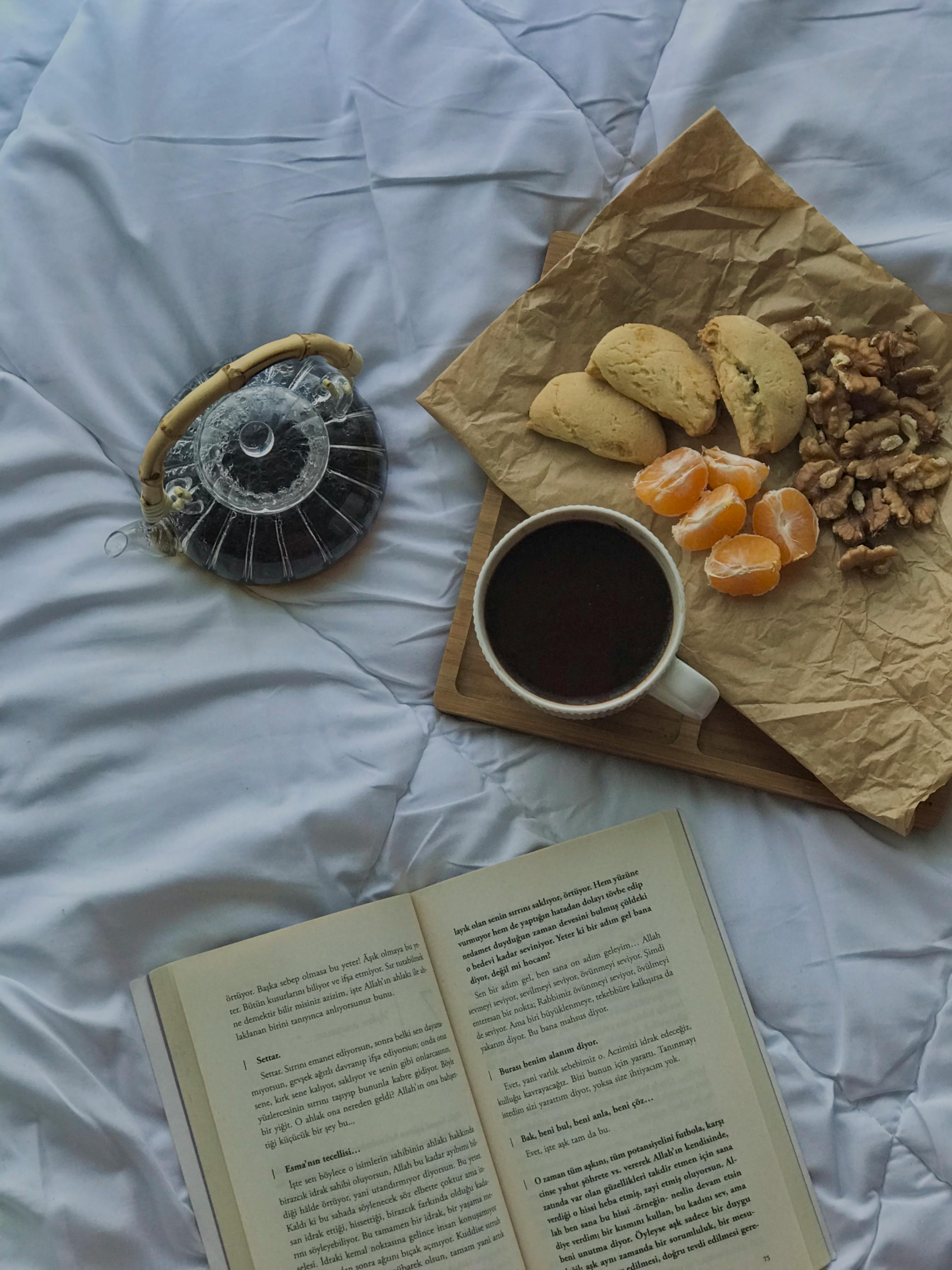 Coffee and book on comfortable bed · Free Stock Photo