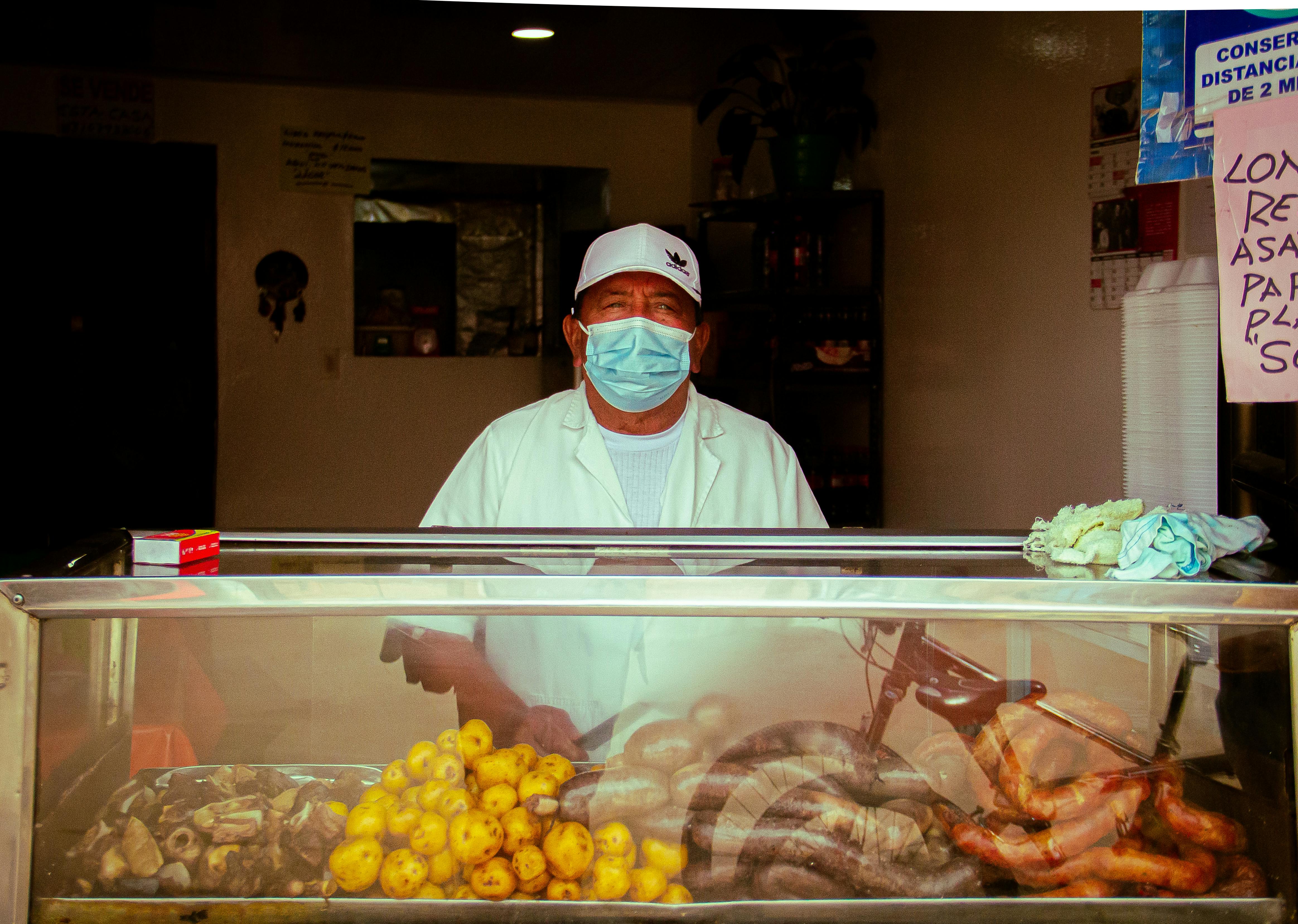 Photo of a Man Selling Food · Free Stock Photo