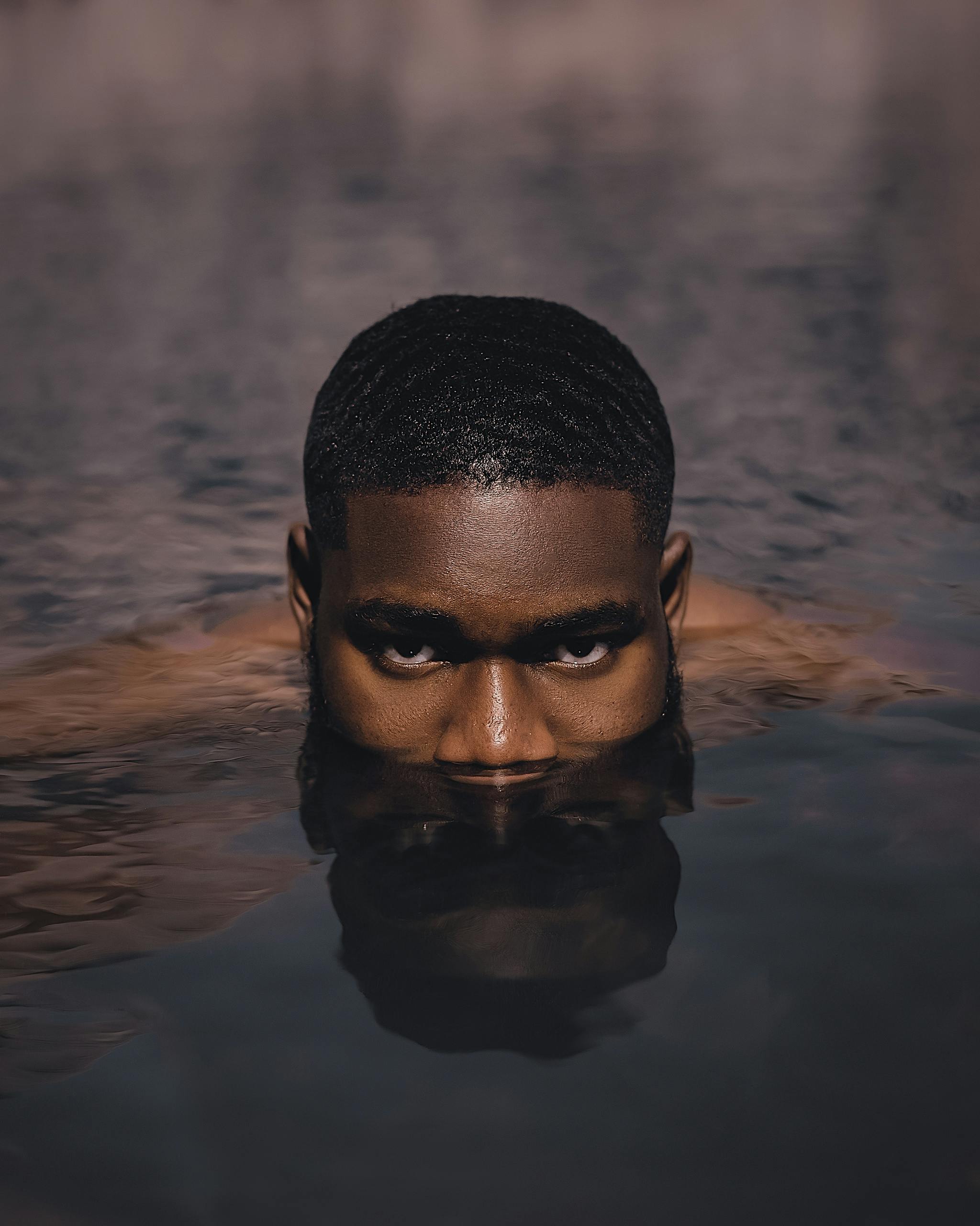 Man with Half of His Face Submerged in Water · Free Stock Photo