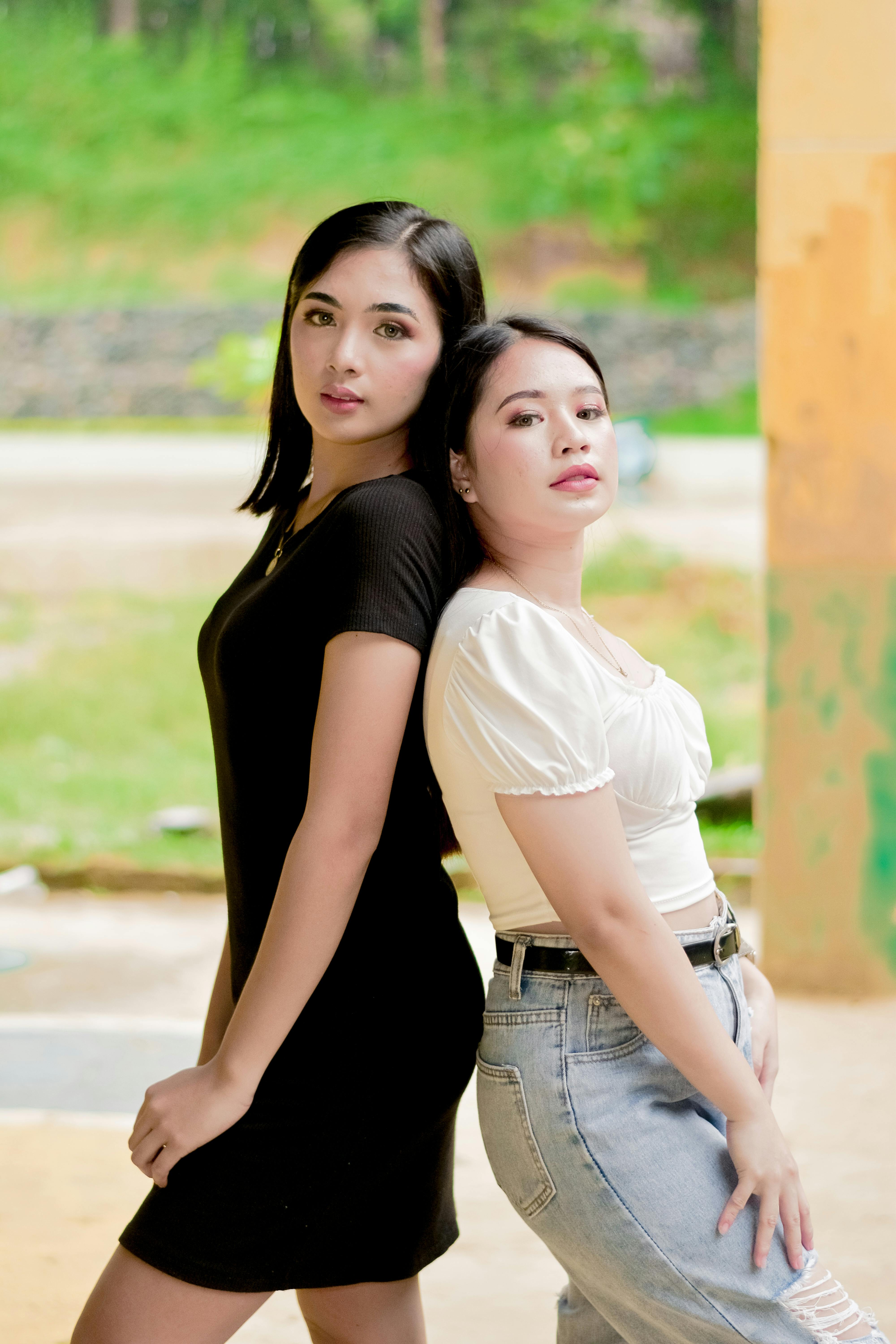 Friends Standing Back to Back · Free Stock Photo