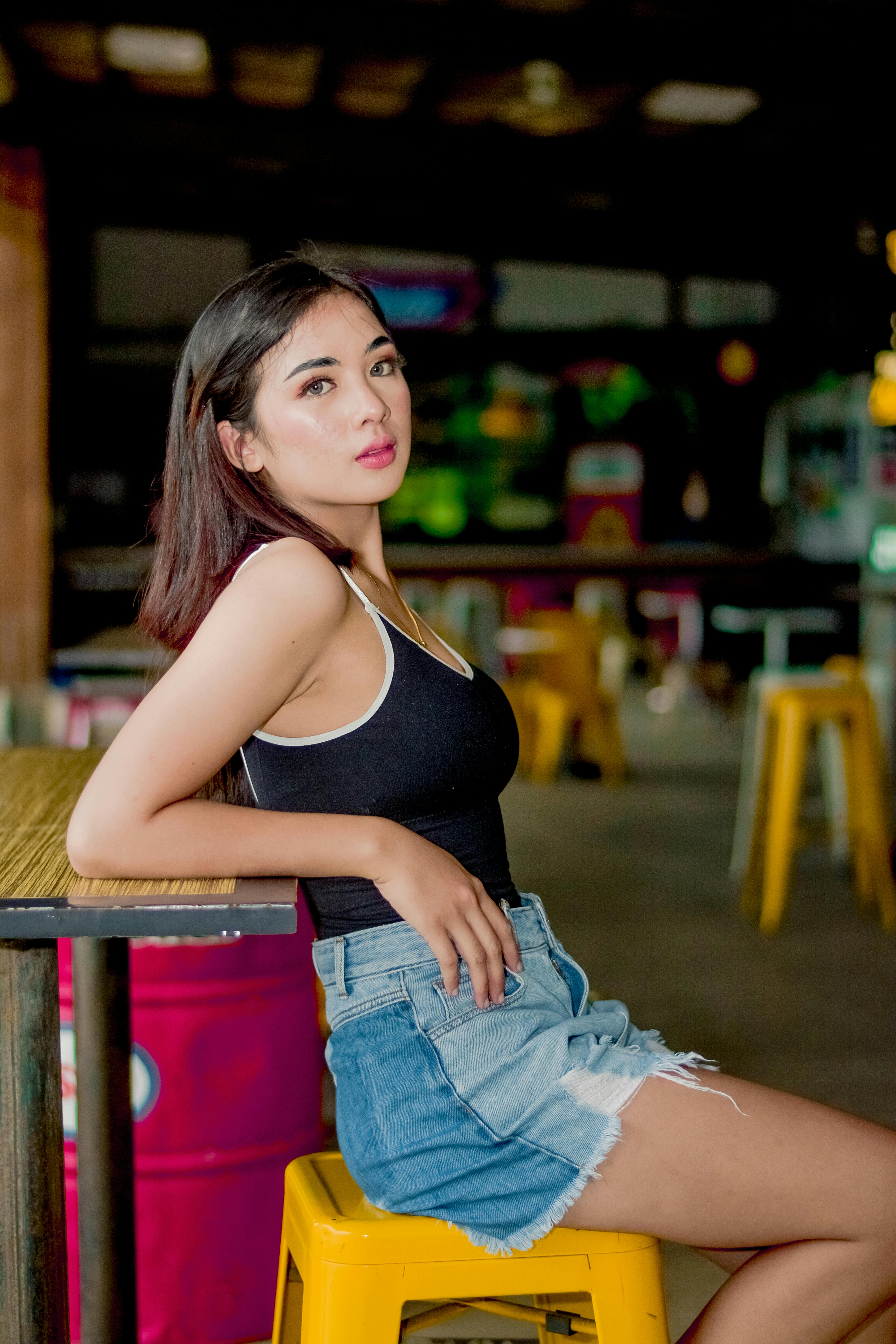 Beautiful Woman Leaning on a Table · Free Stock Photo