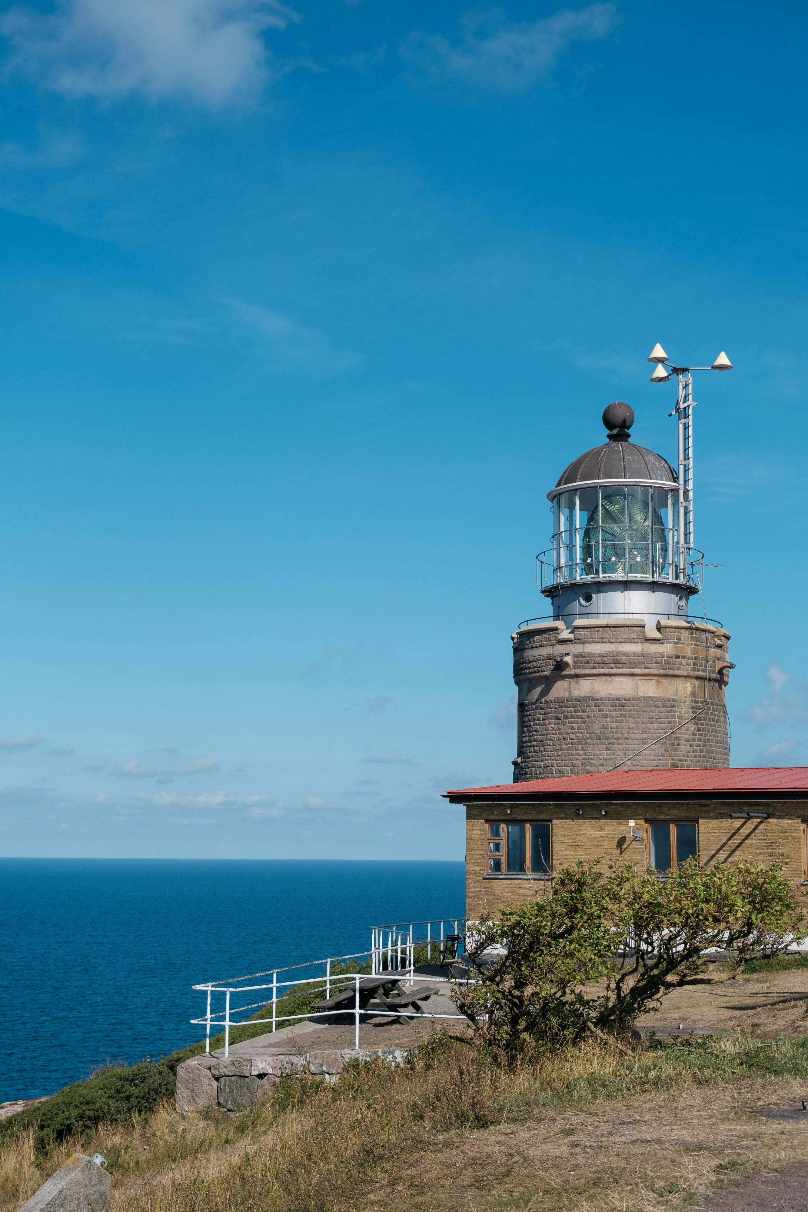 Lighthouse on Beach · Free Stock Photo