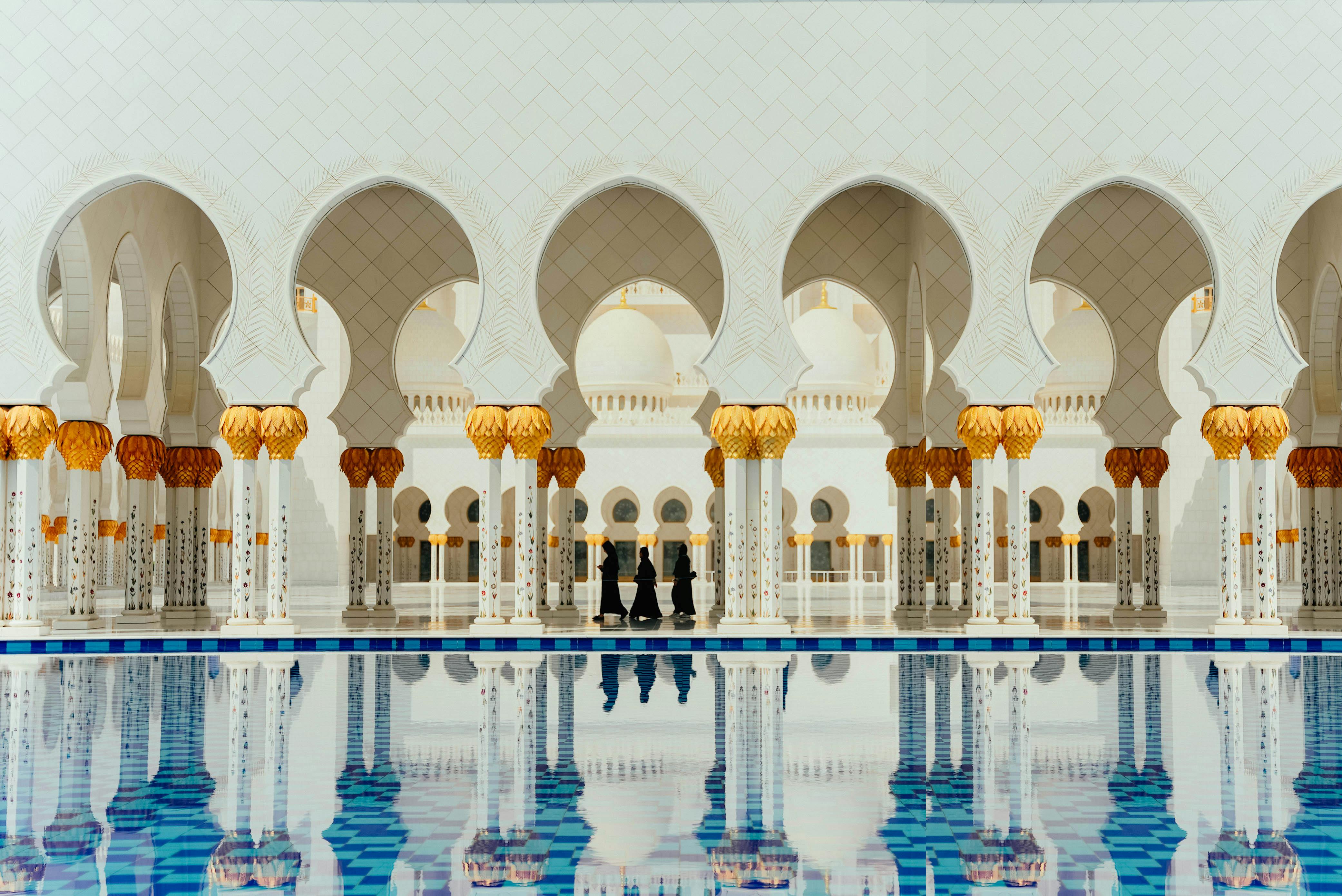 People Walking on Mosque Courtyard · Free Stock Photo