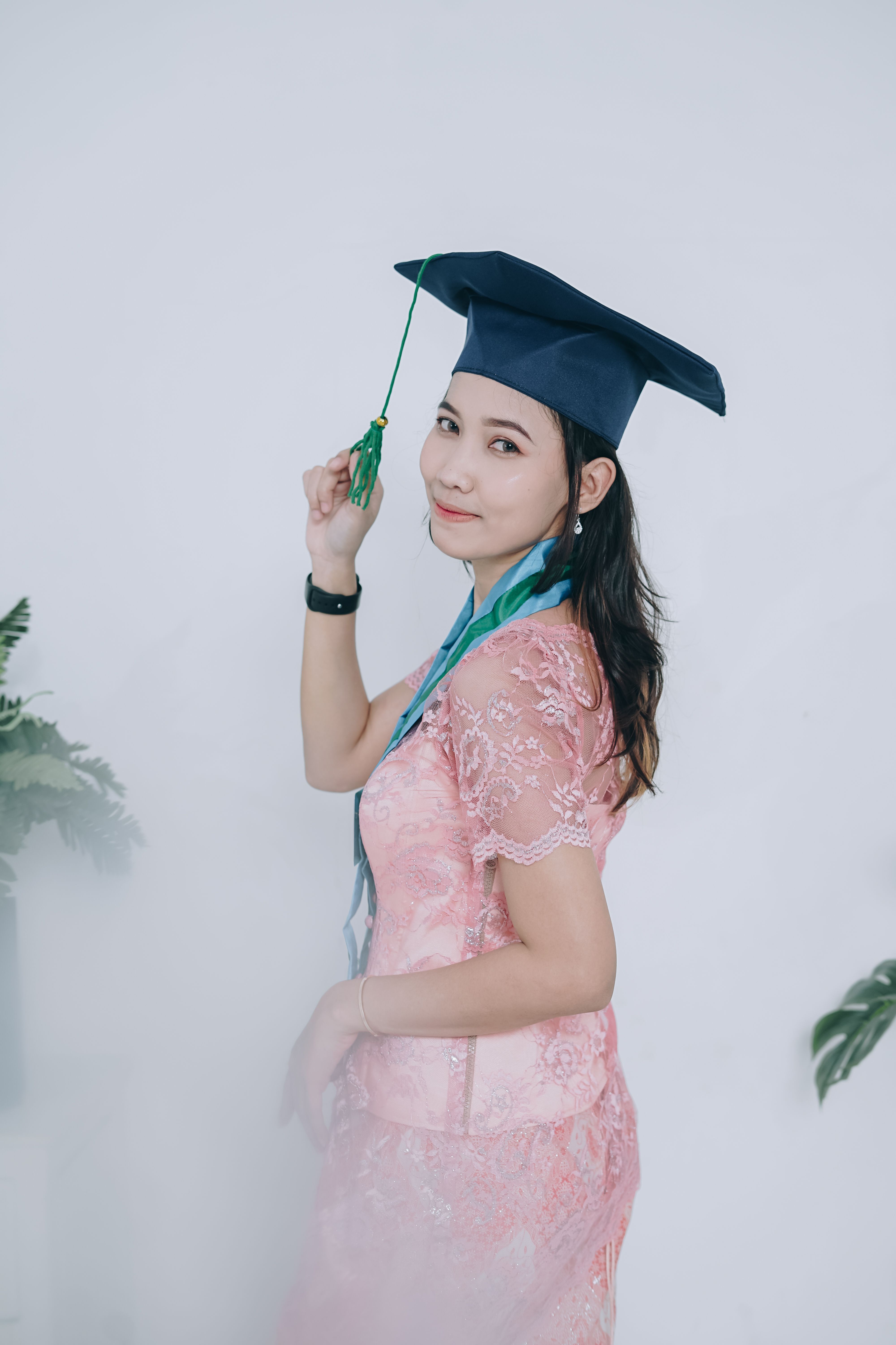 Woman in Pink Dress Wearing Graduation Cap · Free Stock Photo