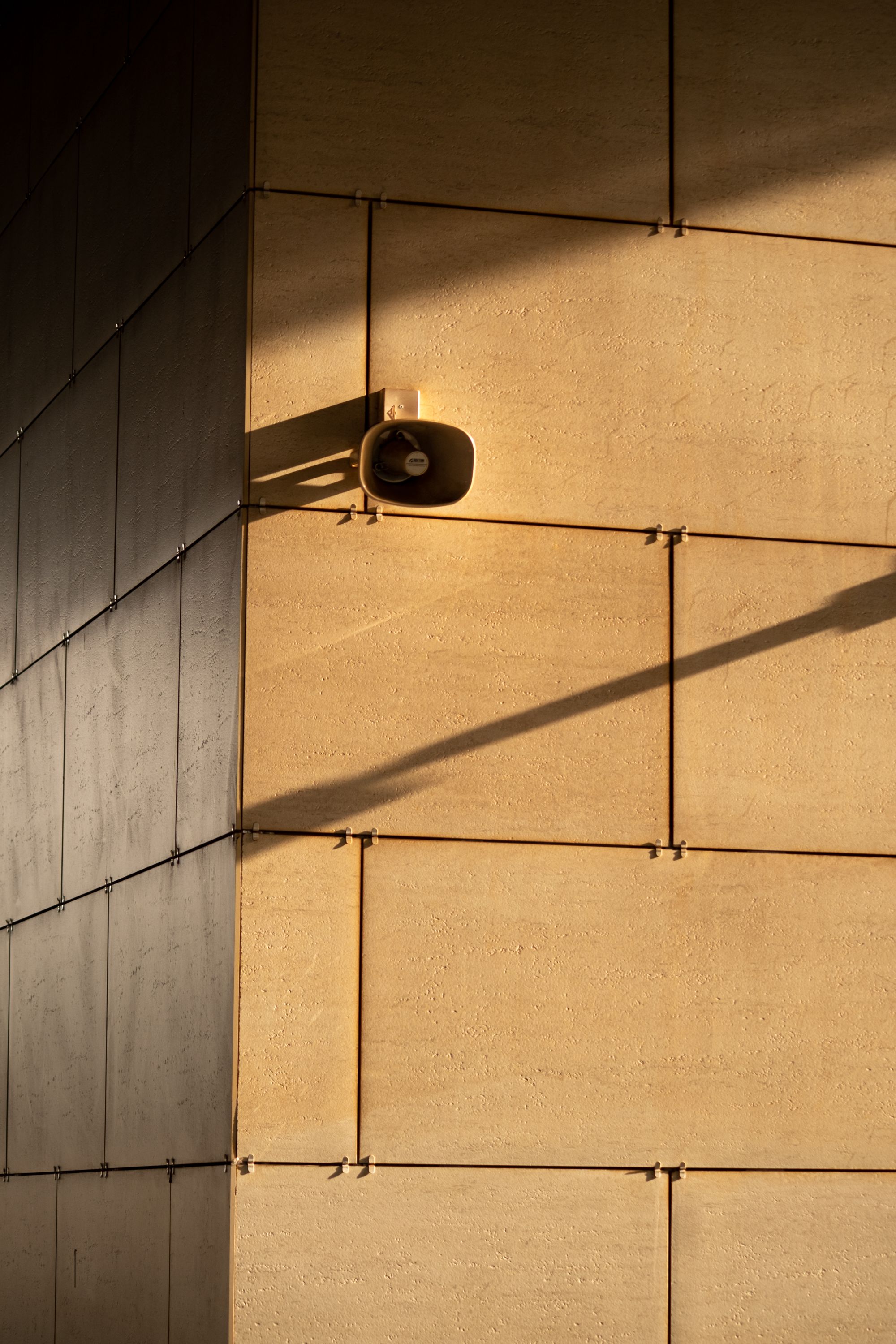 A CCTV Camera Mounted on a Concrete Wall · Free Stock Photo