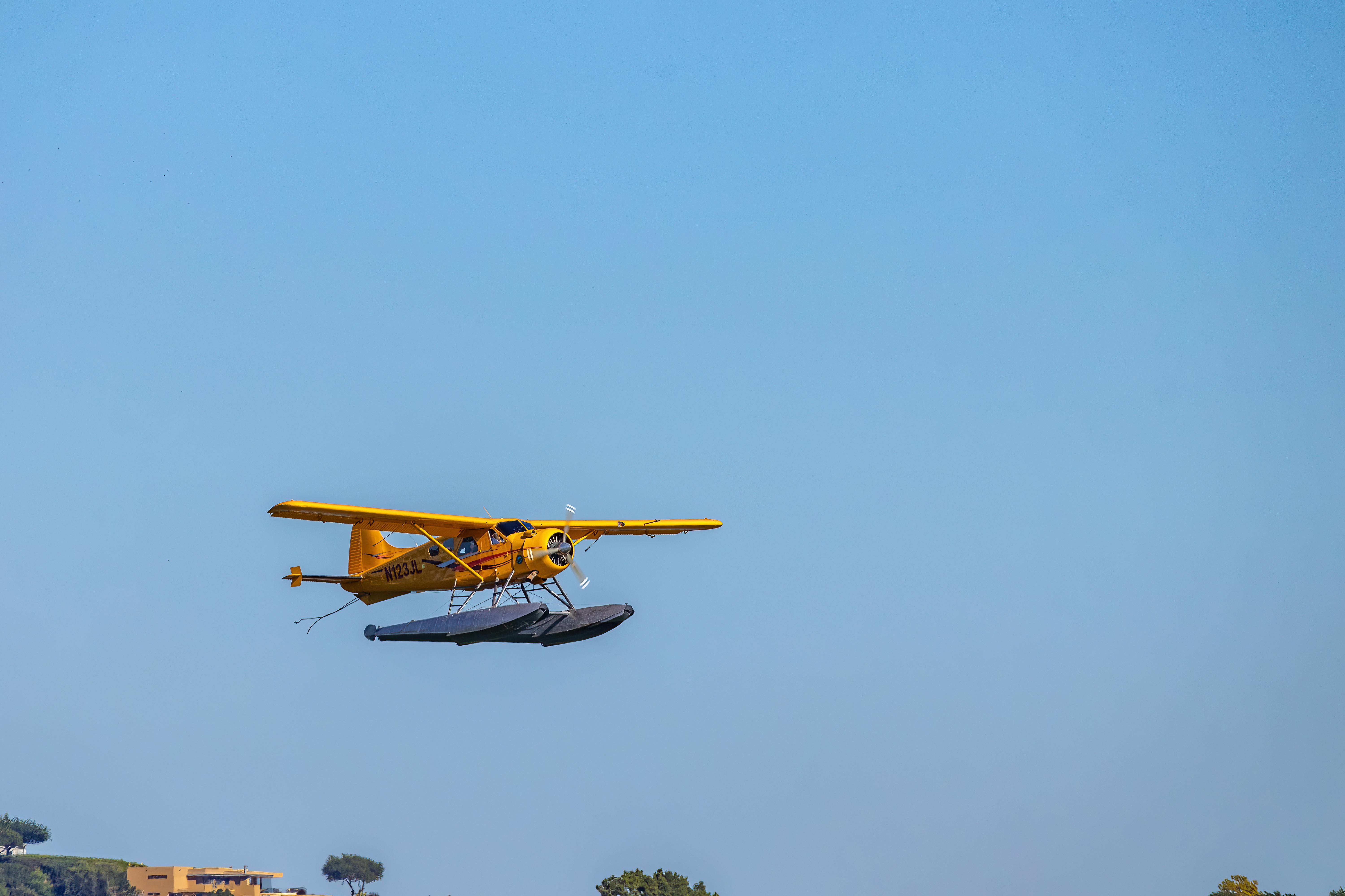 Yellow Airplane Flying in the Sky · Free Stock Photo