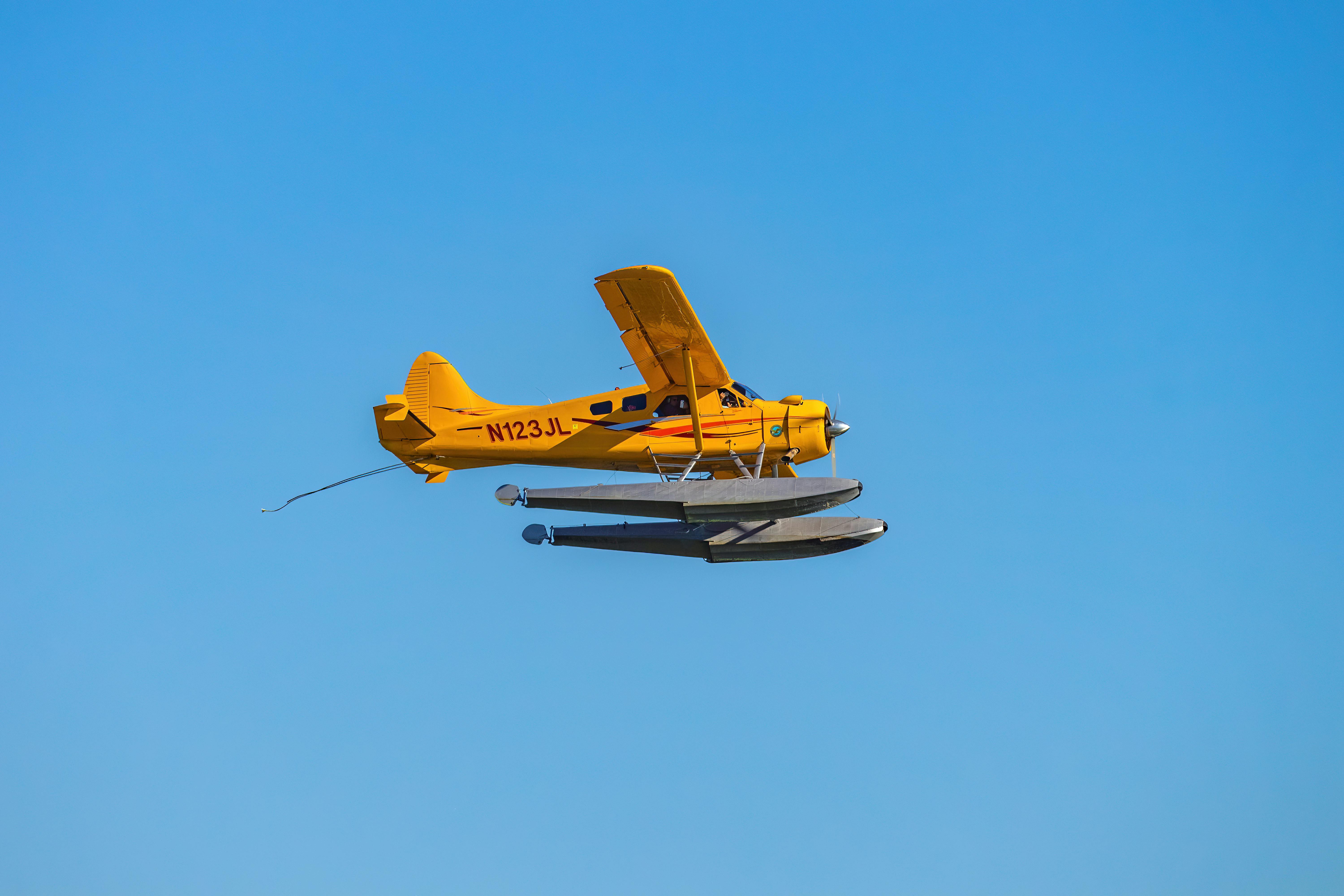 Yellow Seaplane in the Mid Air · Free Stock Photo
