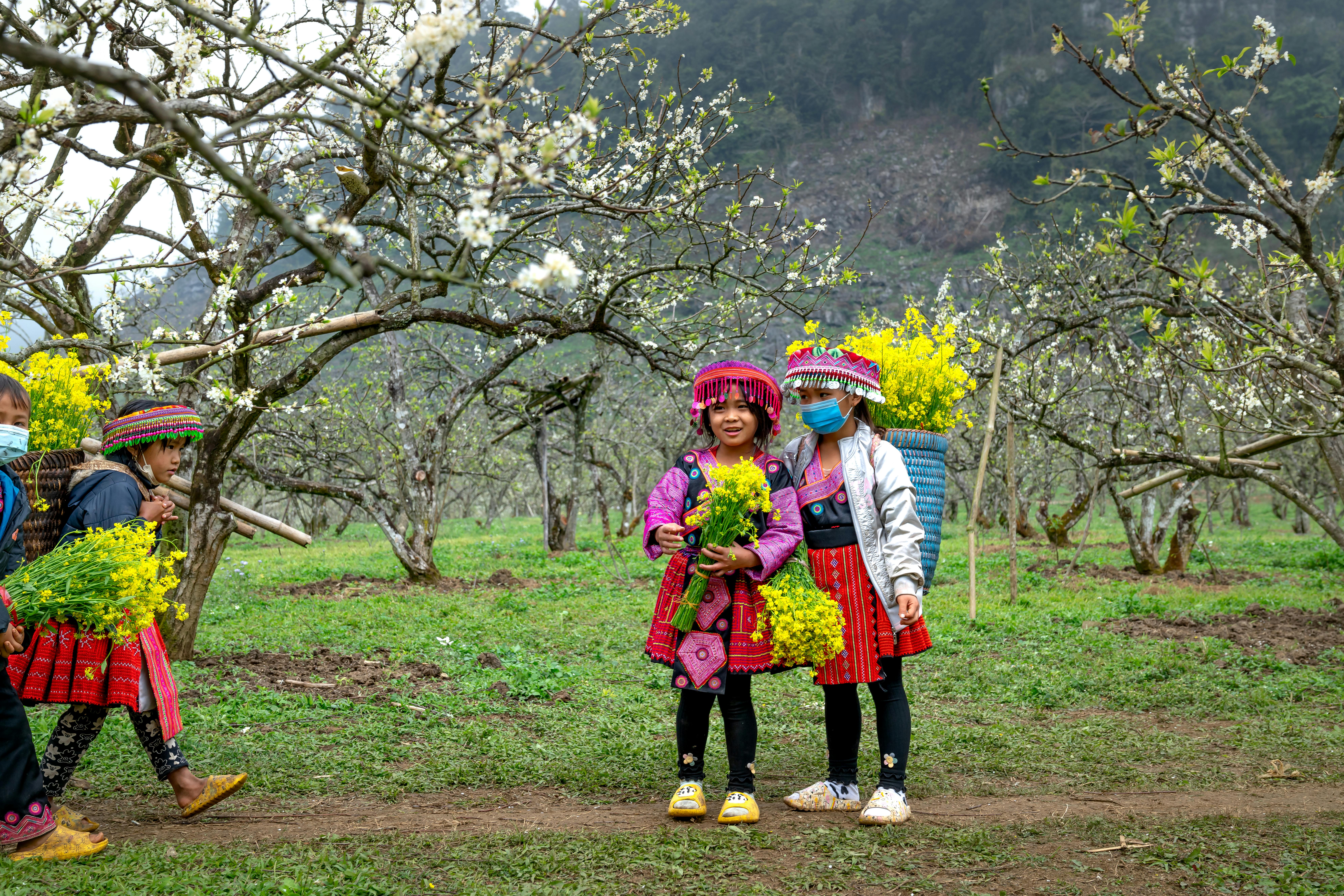Standing Children Holding Flowers · Free Stock Photo