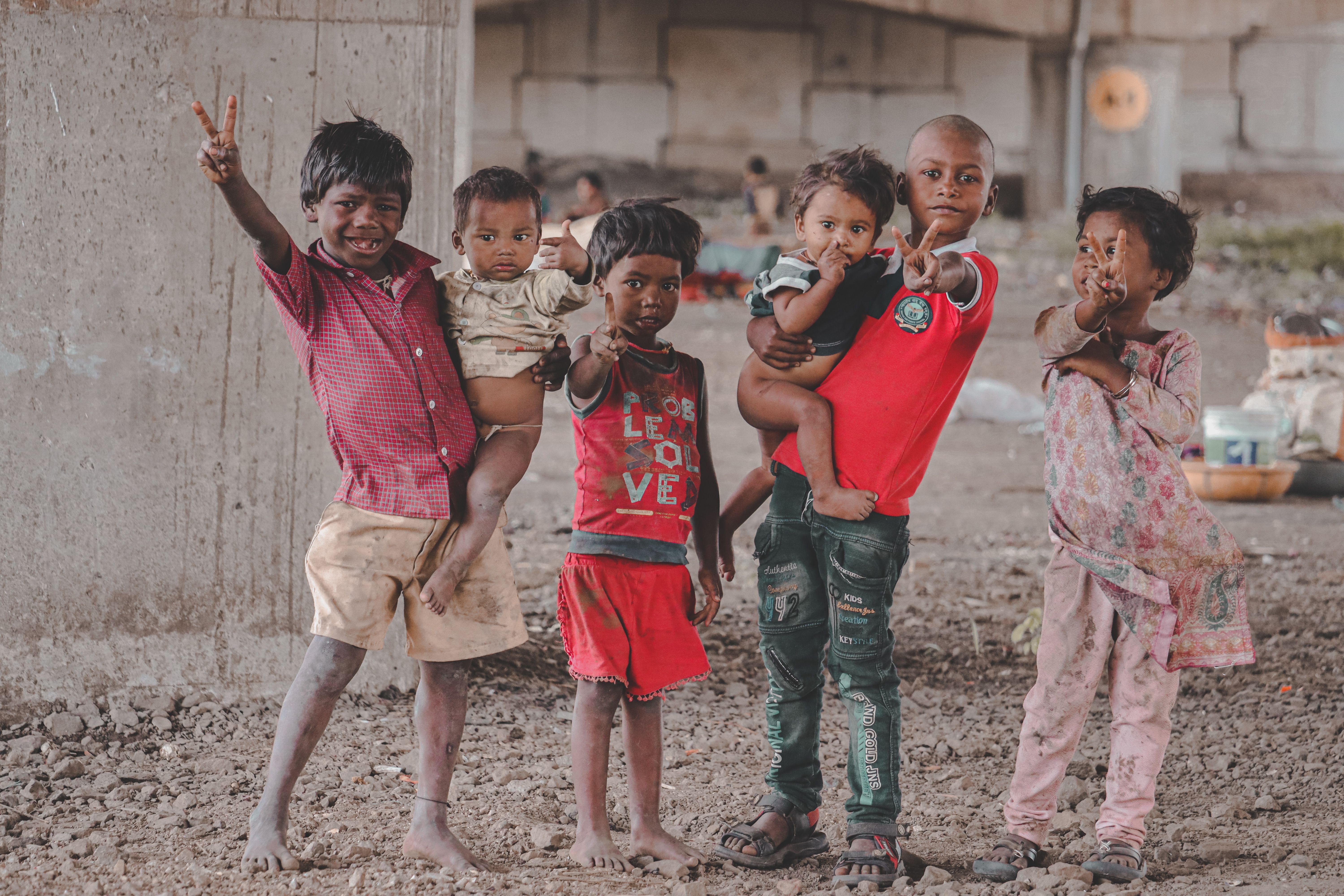 Smiling Children on Sidewalk · Free Stock Photo